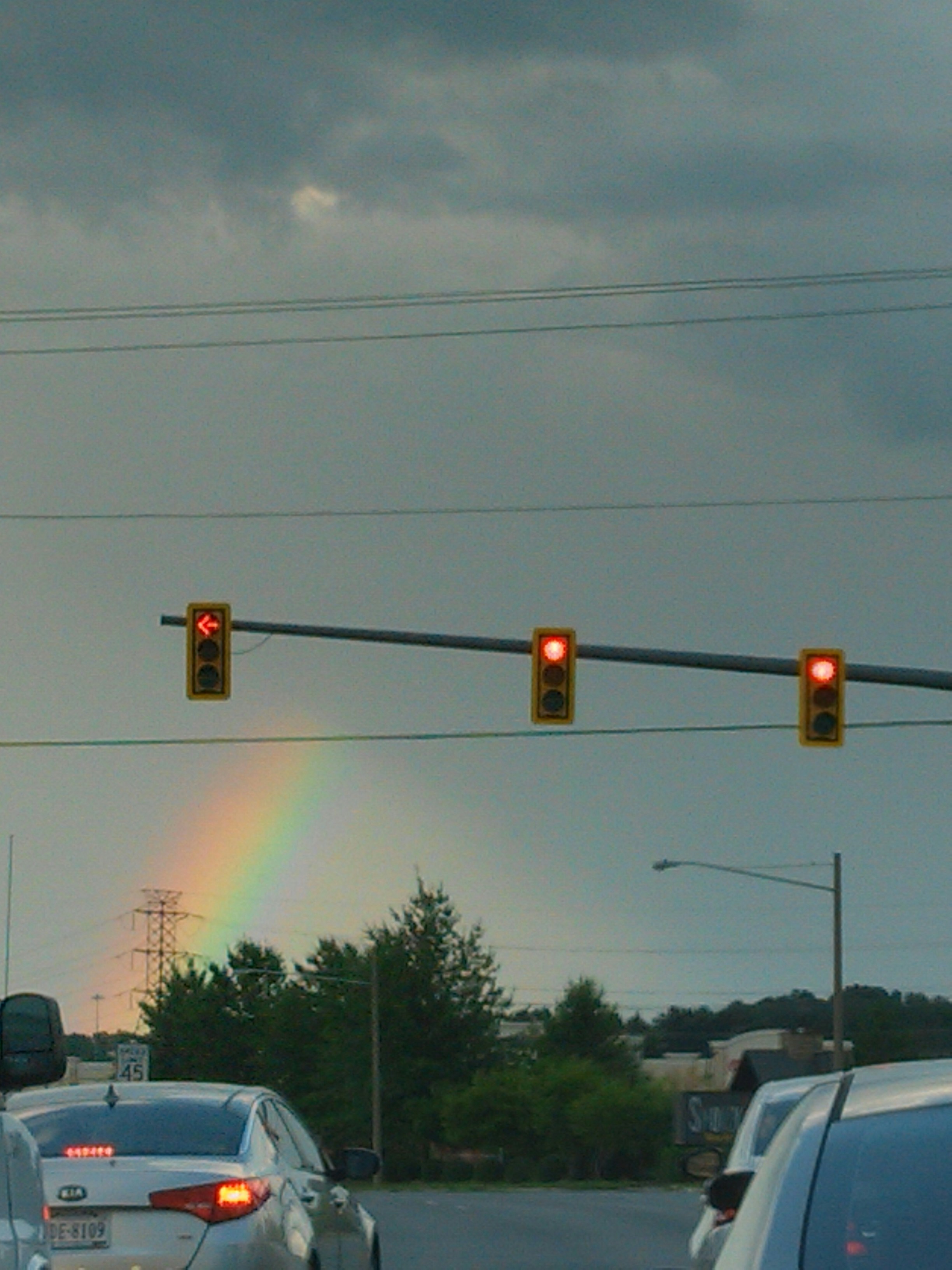 Traffic light with red light photo – Free Rainbow sky Image on Unsplash