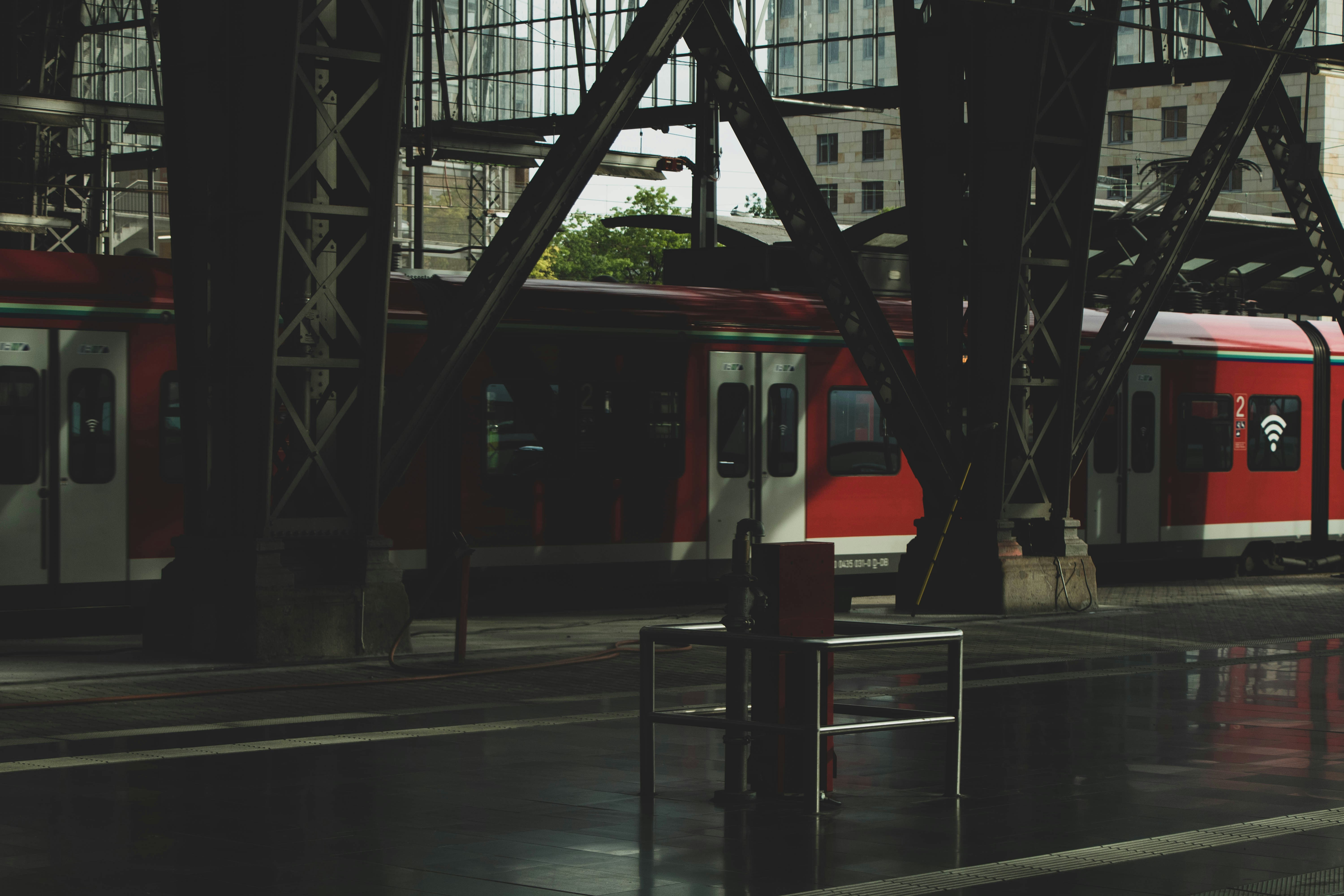 red and white train in train station