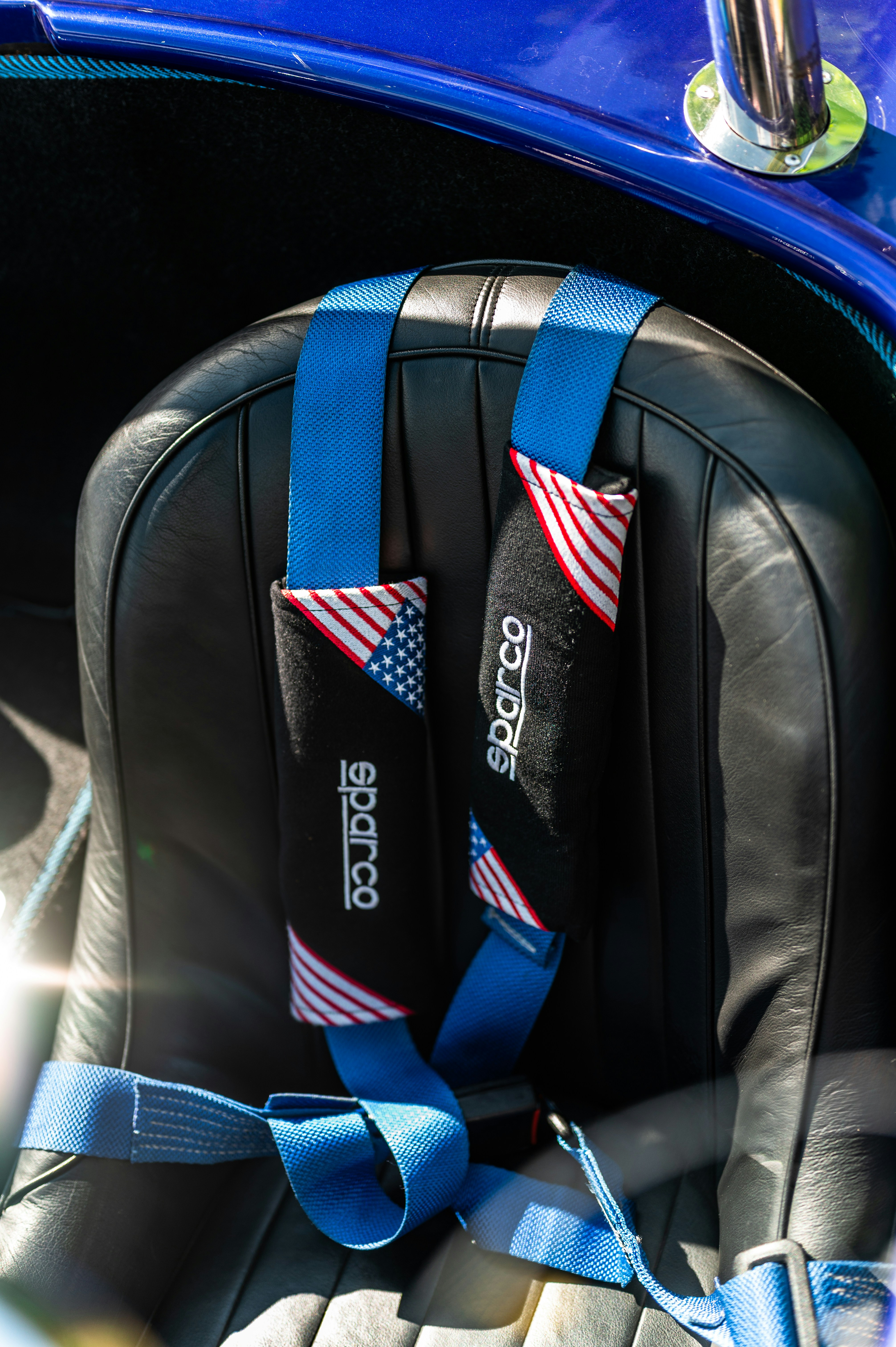 Blue Straps and Black Leather: Racing Seating Close-Up