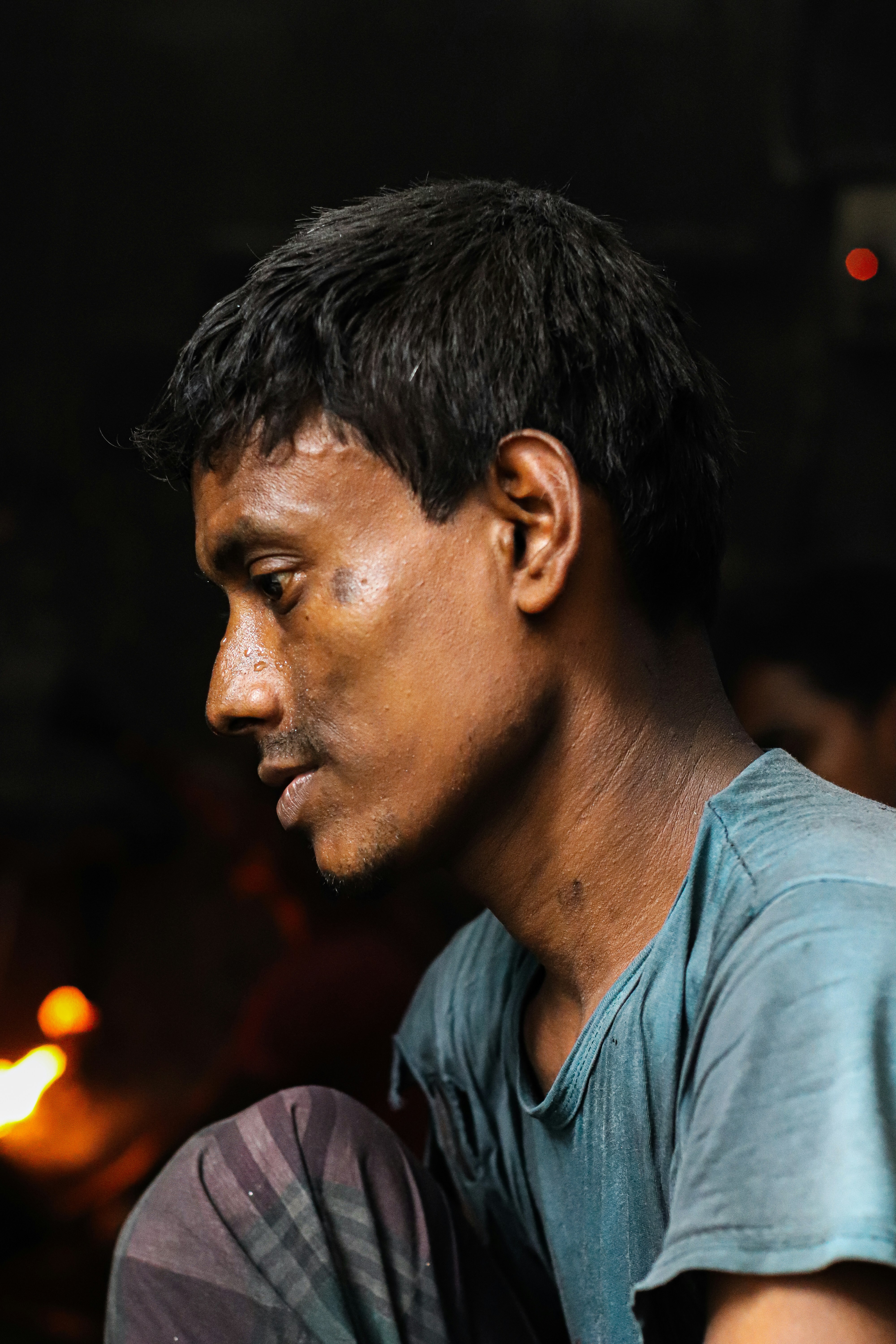 Side Portrait in Warm Torchlight