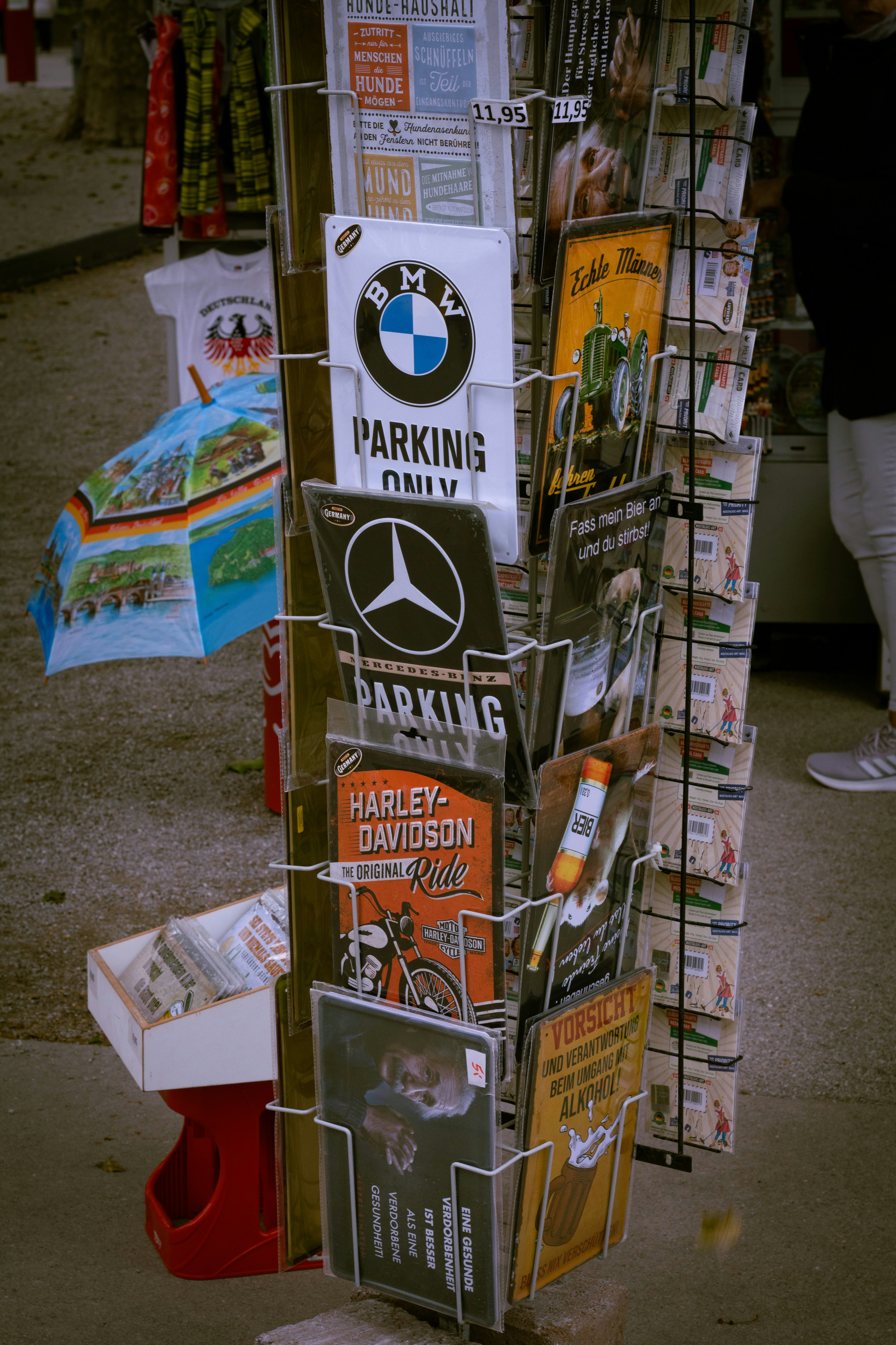 Emblem Stack: A Streetfront Mini Museum of Car Logos and Travel Ephemera