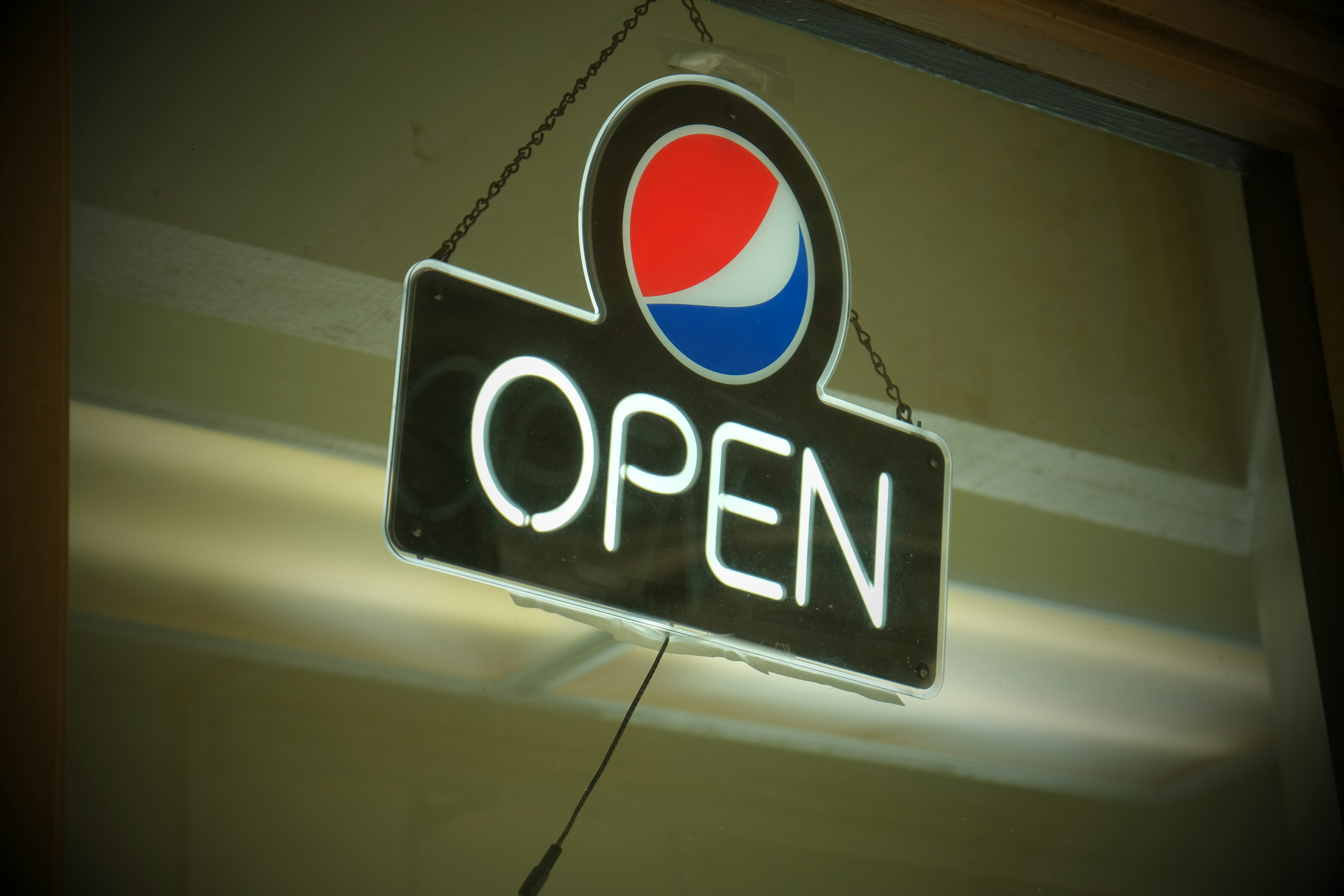 Neon Open Sign Basking in Soft Evening Glow