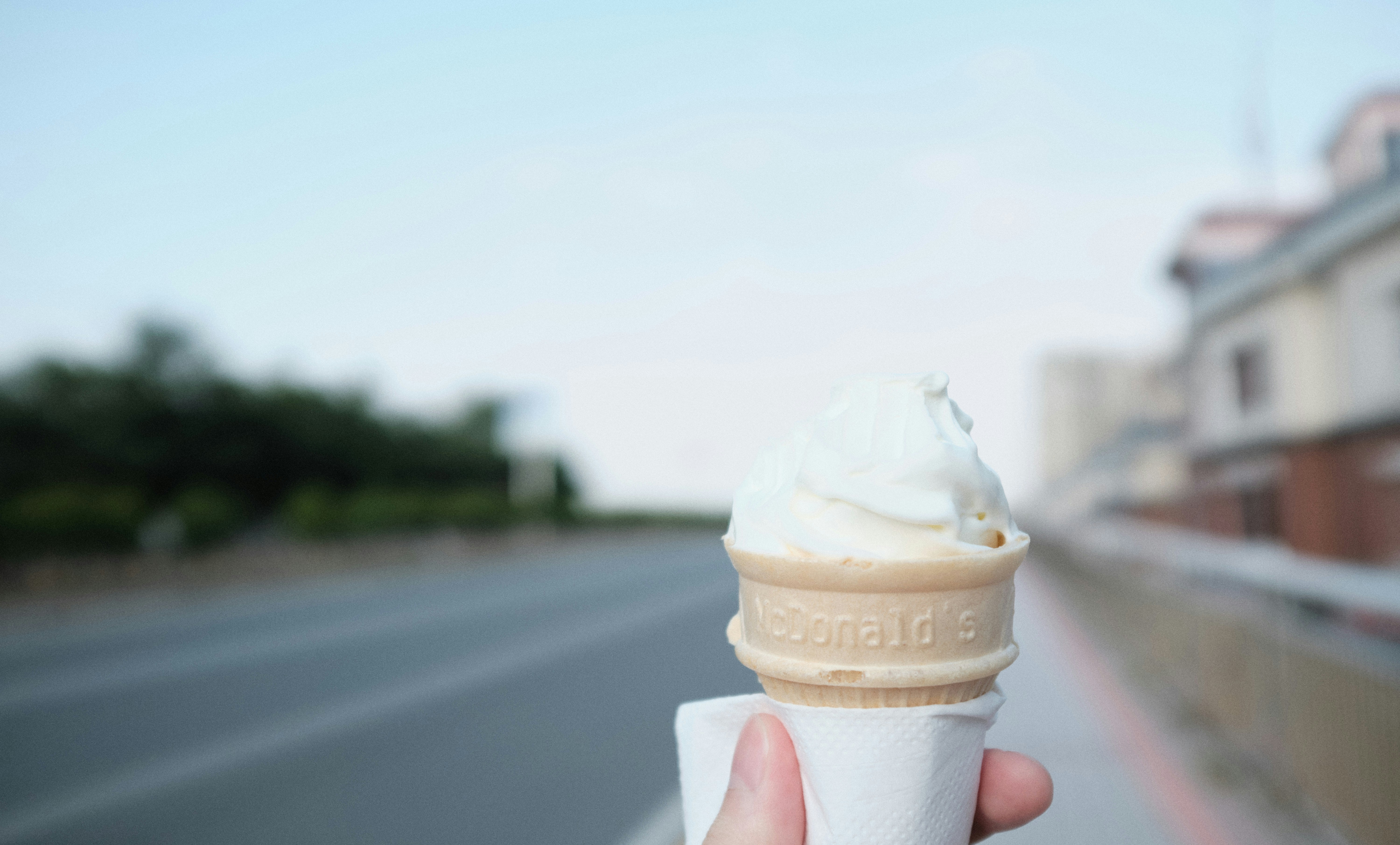Vanilla in Focus, City in Blur: A Handheld Cone on the Street