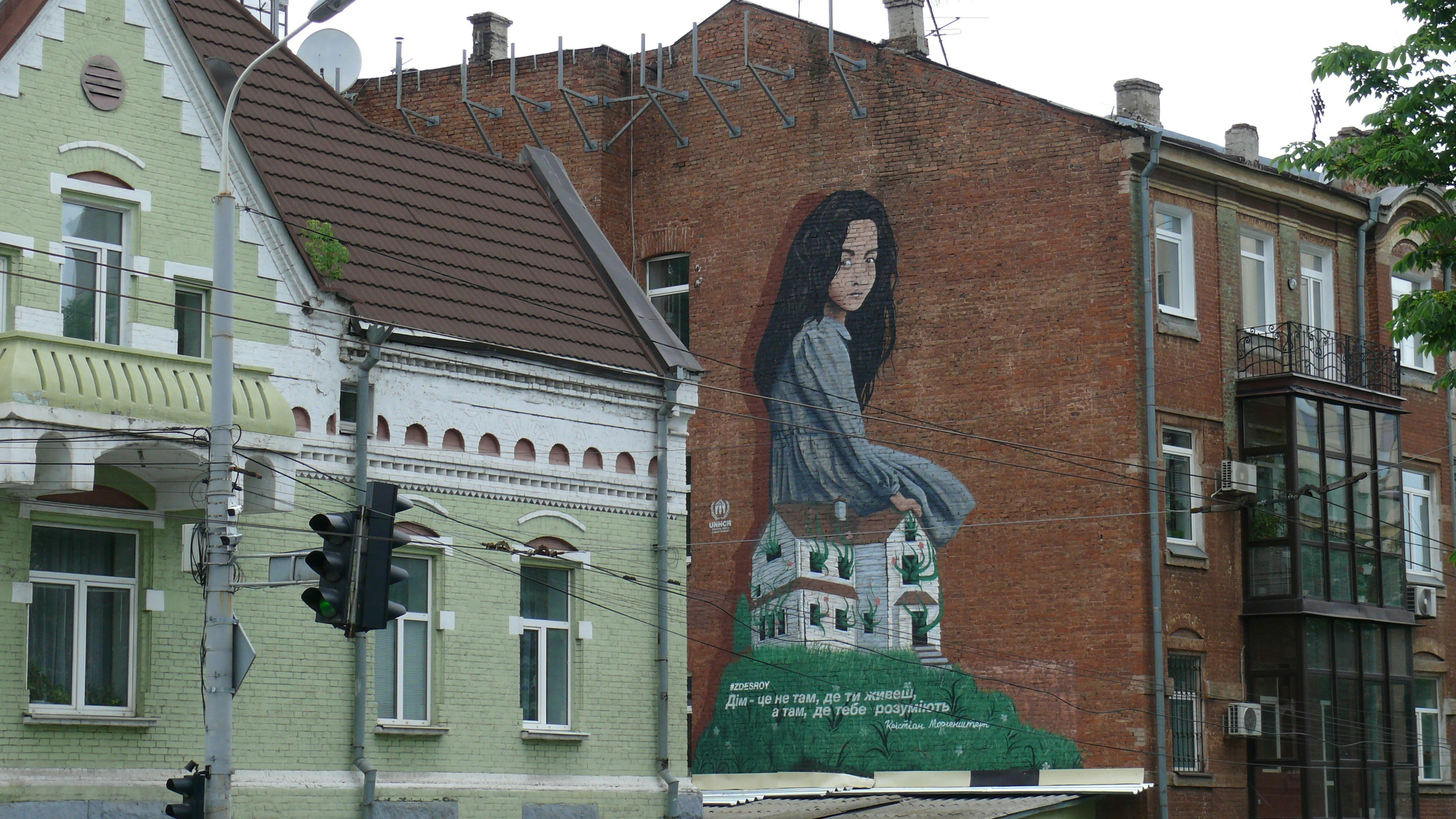 Girl on Brick Horizon: Muralscape Above a Tiny House