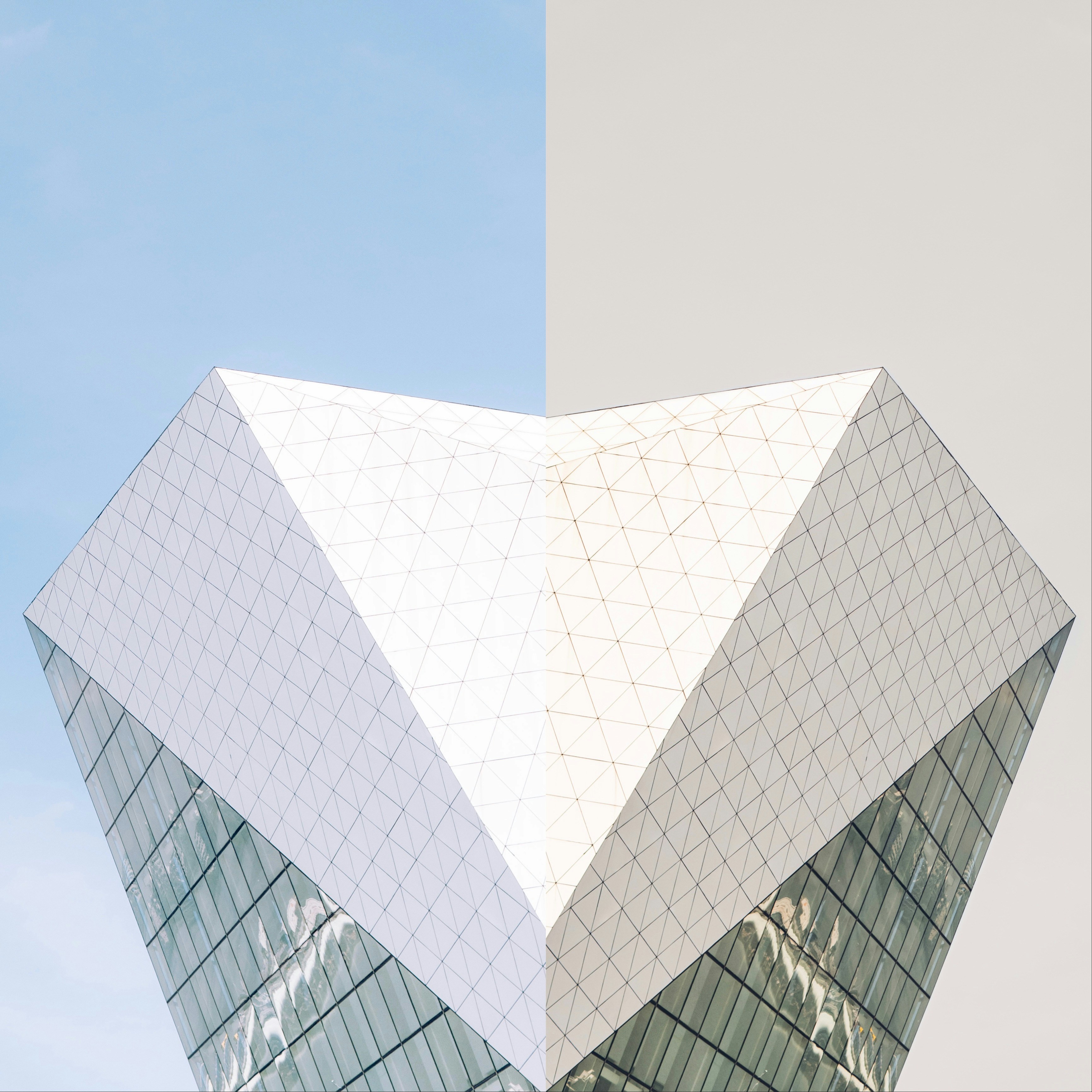 A tall white building with a triangular roof photo – Free Johor bahru ...