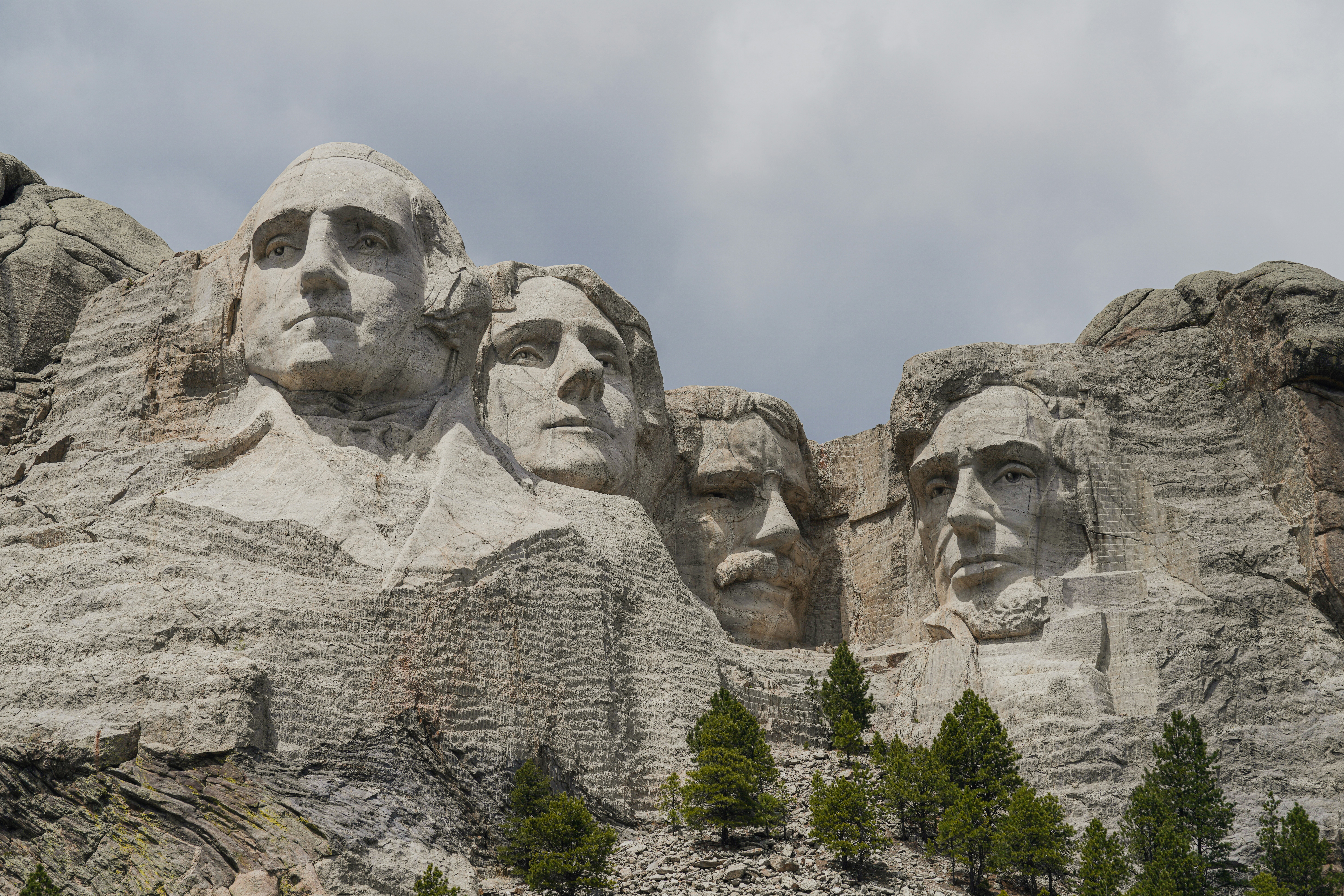 A group of presidents carved into the side of a mountain photo – Free ...