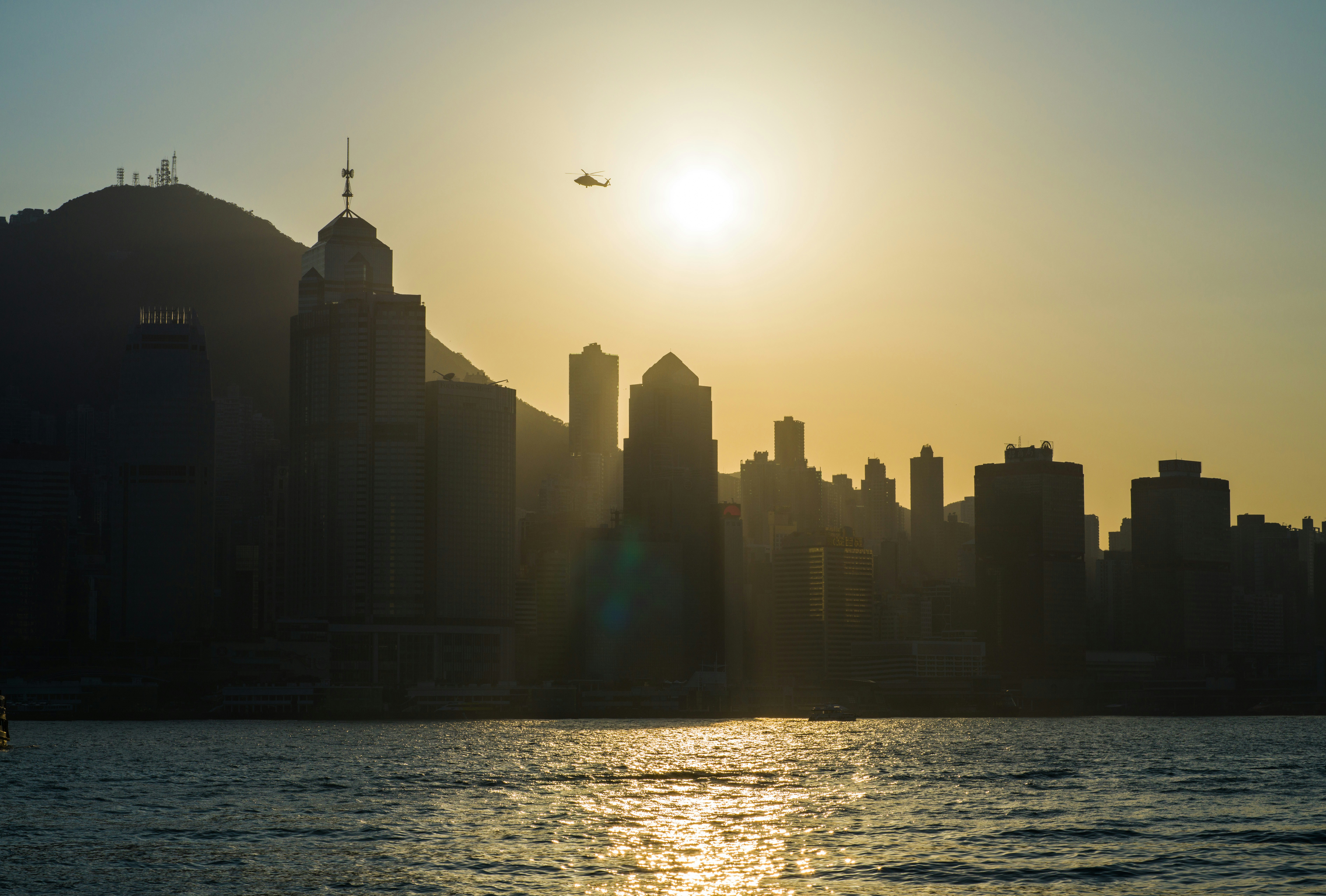 silhouette of city buildings during sunset