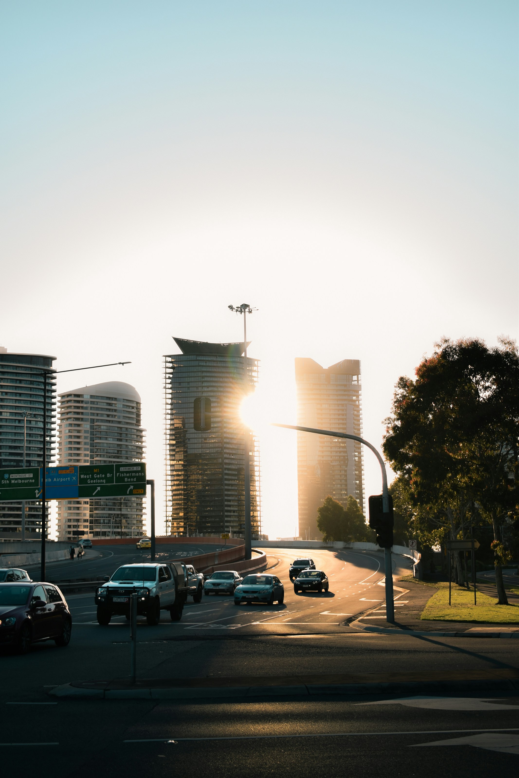 Cars parked on parking lot near high rise buildings during daytime ...