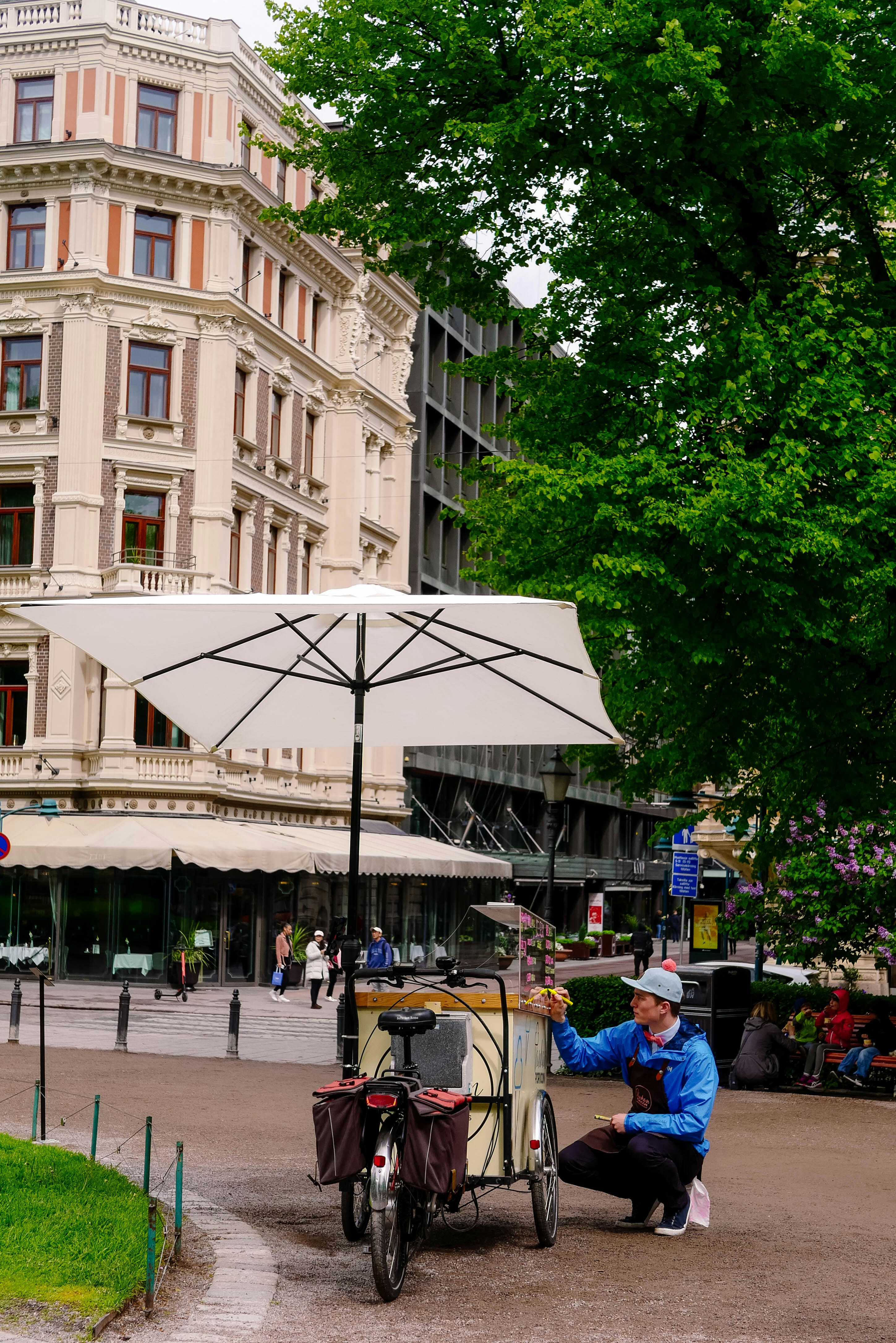 Street Corner Alchemist: A Bicycle Cart, a Canvas Umbrella, and a Quiet City Moment