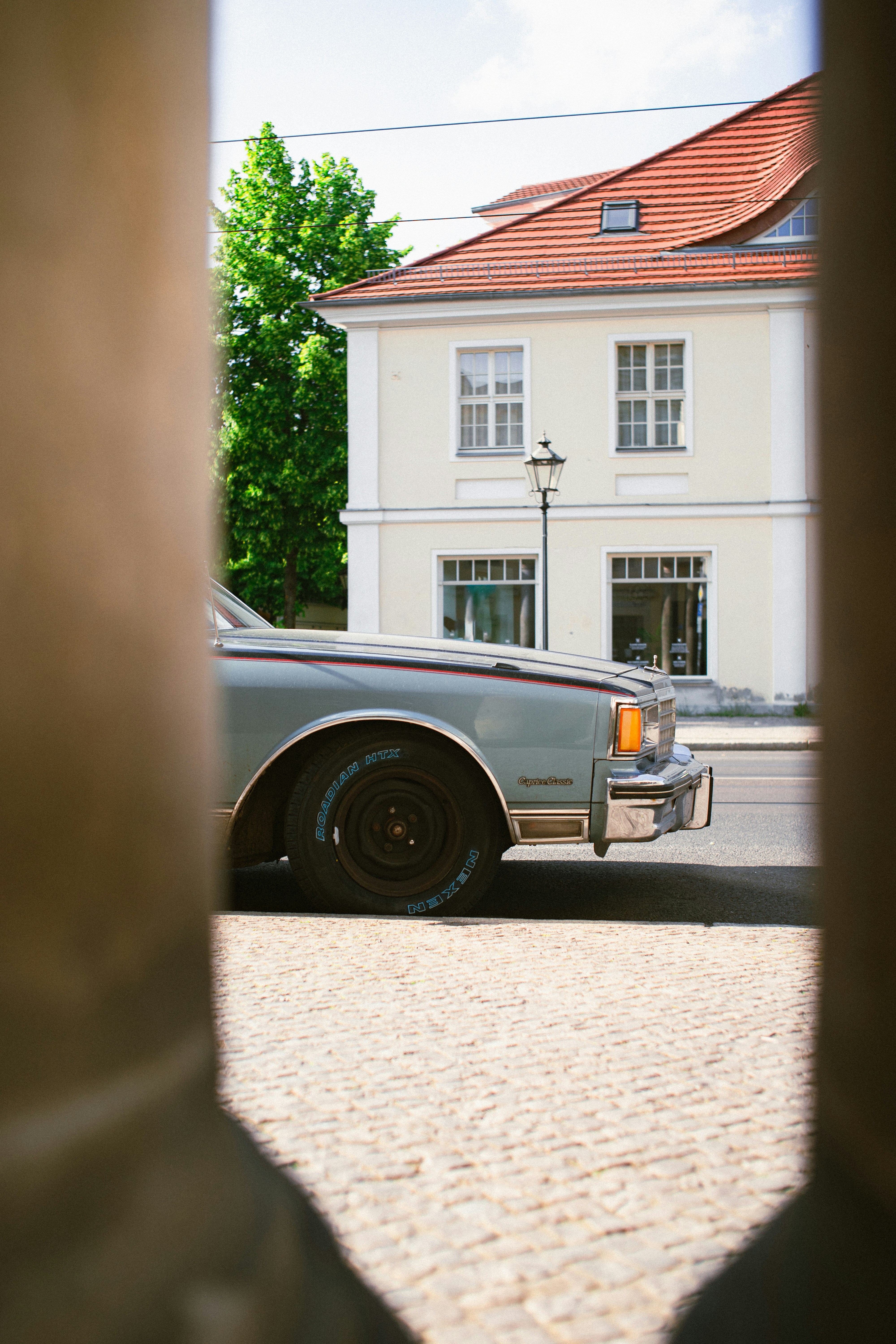 a small truck parked on the side of a building