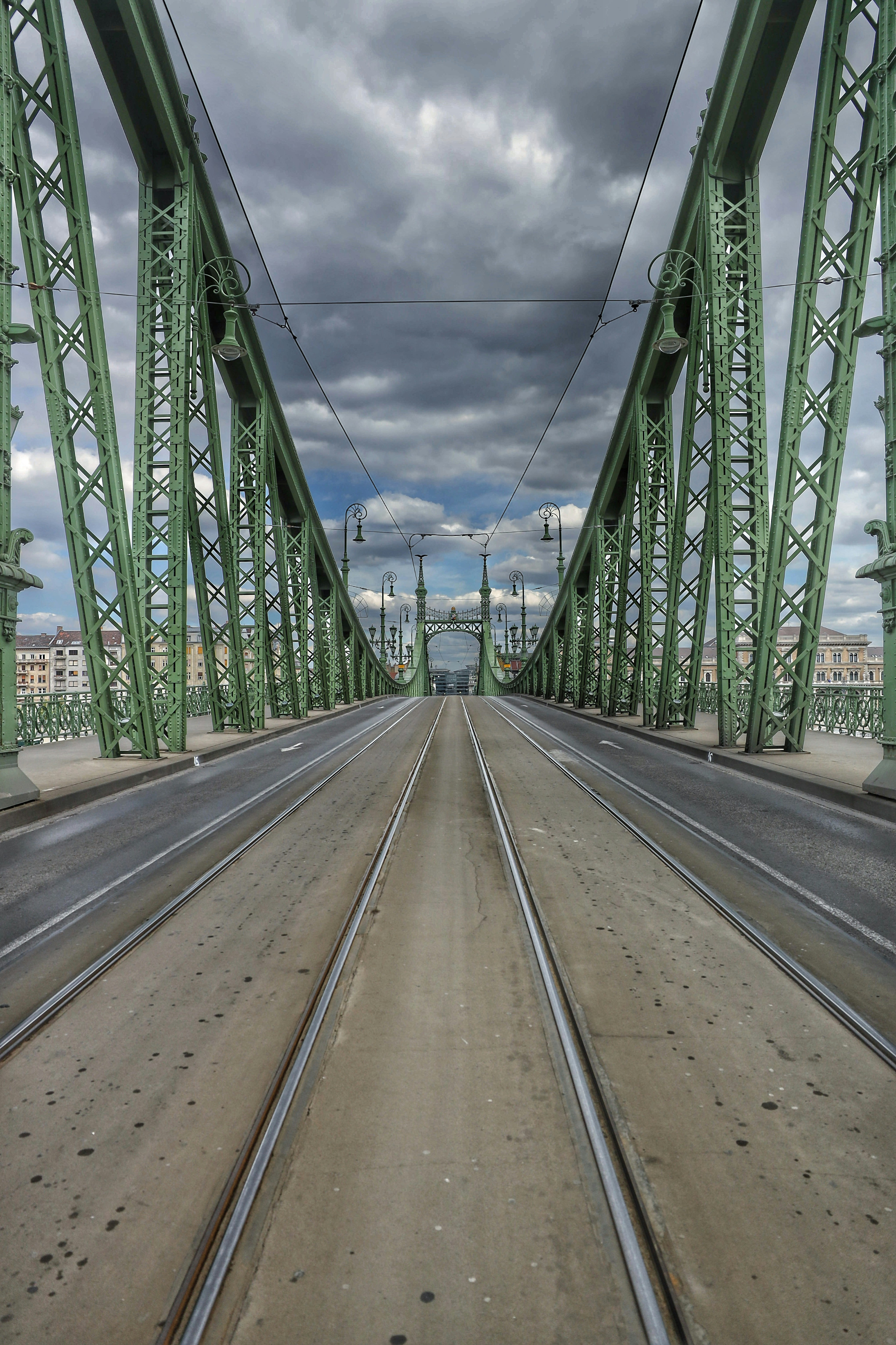 Convergence Across the Green Truss Bridge under a Moody Sky