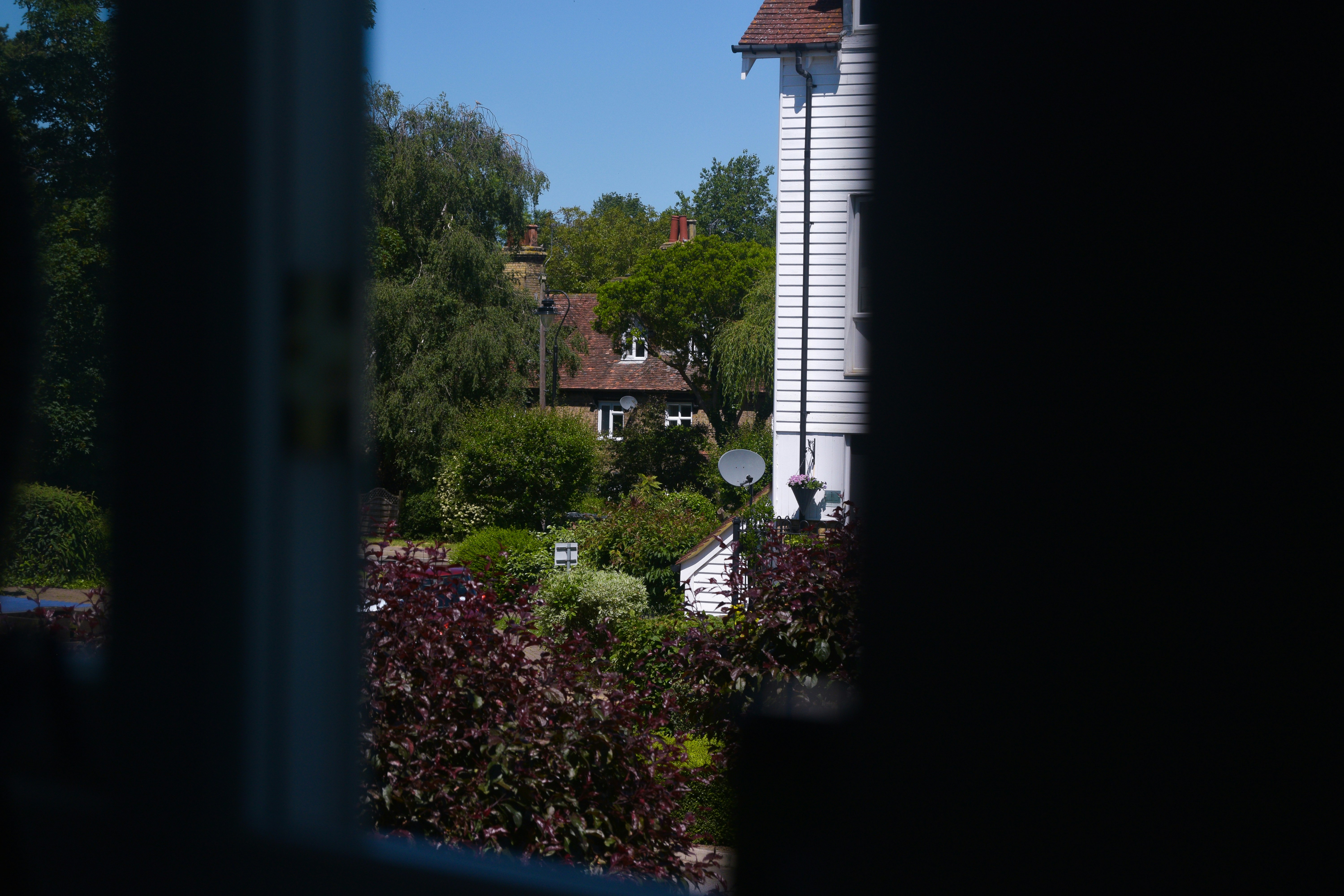 A view of a house through a window photo – Free Urban Image on Unsplash