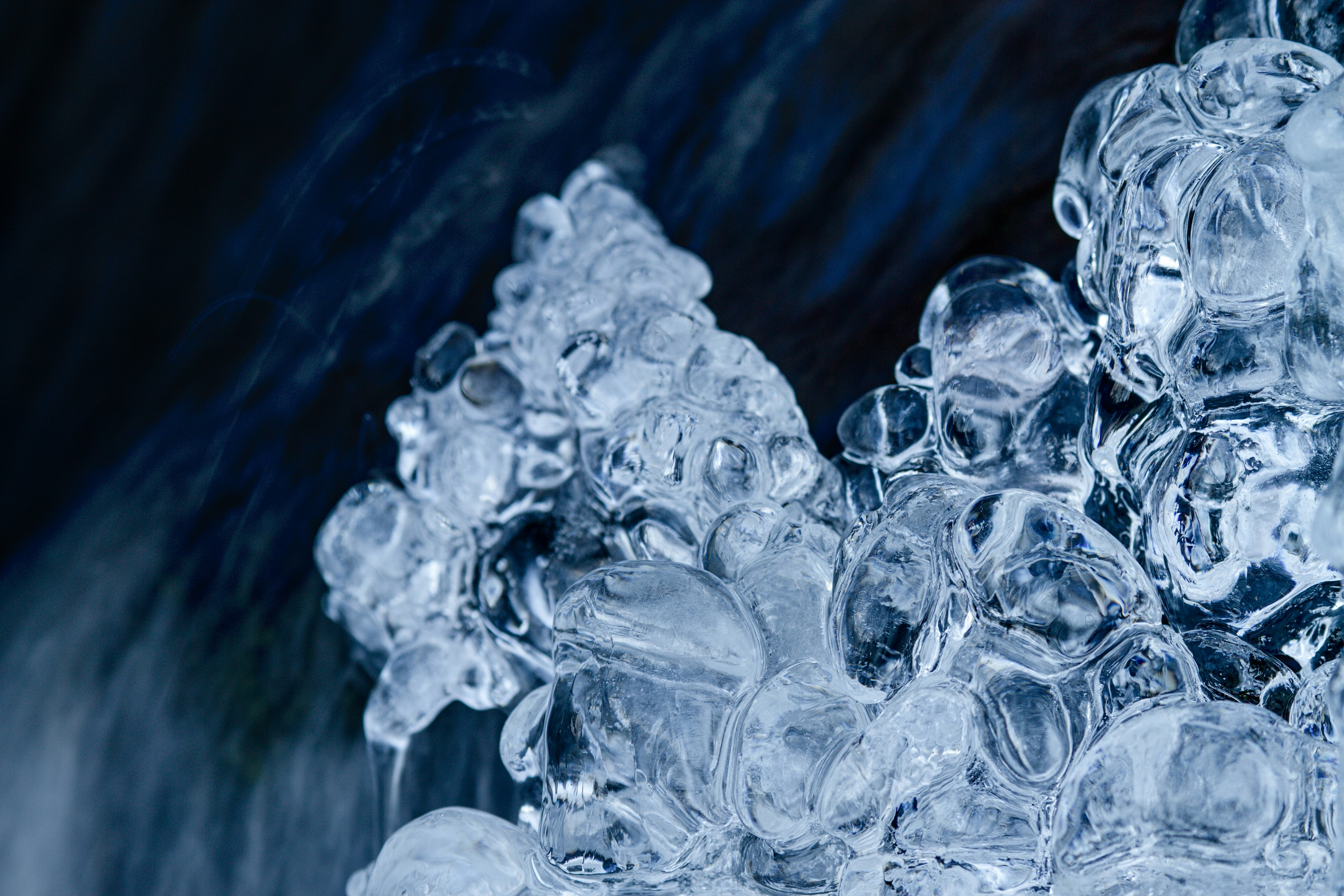 A pile of ice cubes sitting on top of a table photo – Free Ice Image on ...