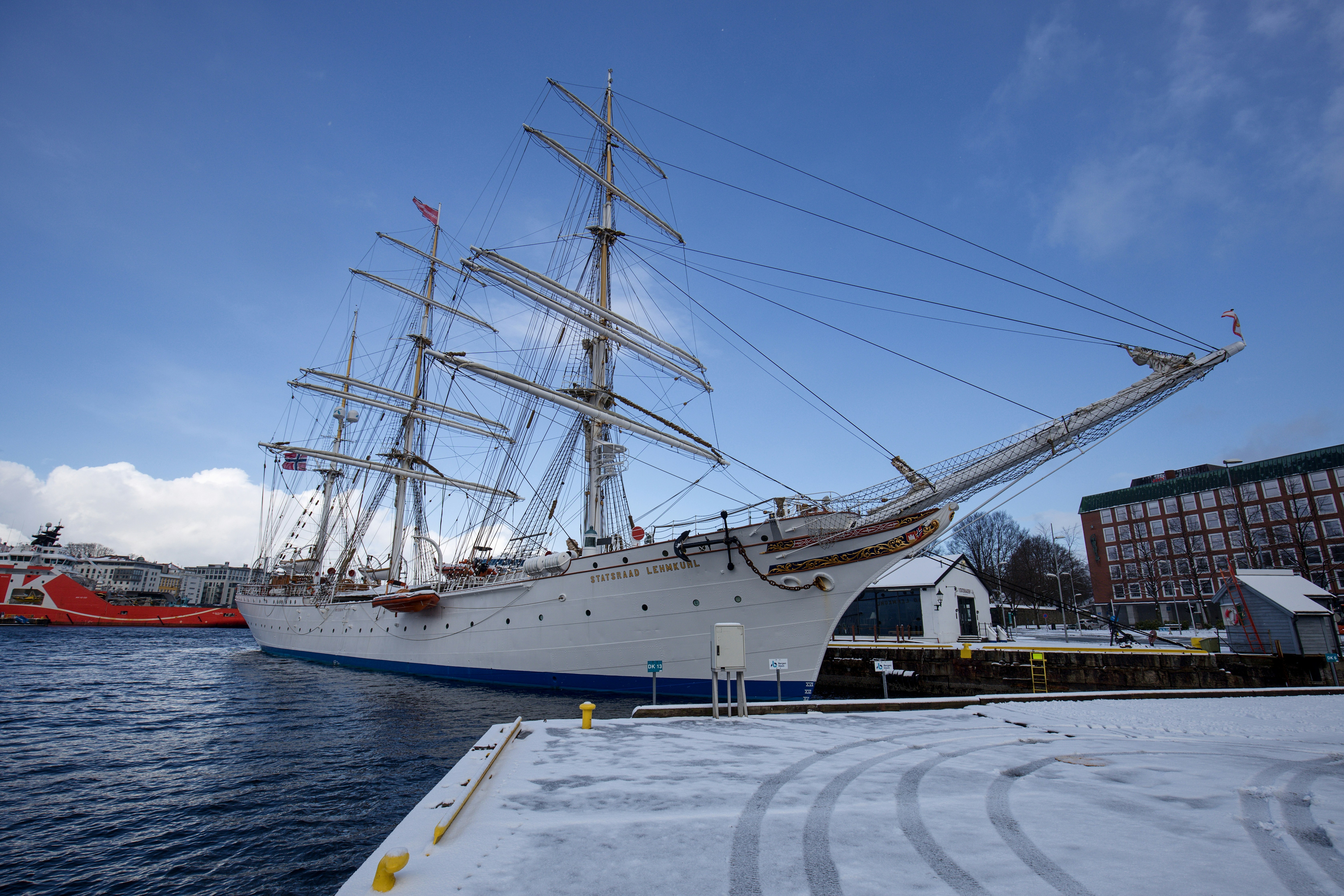 Hawser at the Dock: The White Tall Ship Piercing a Clear Winter Sky