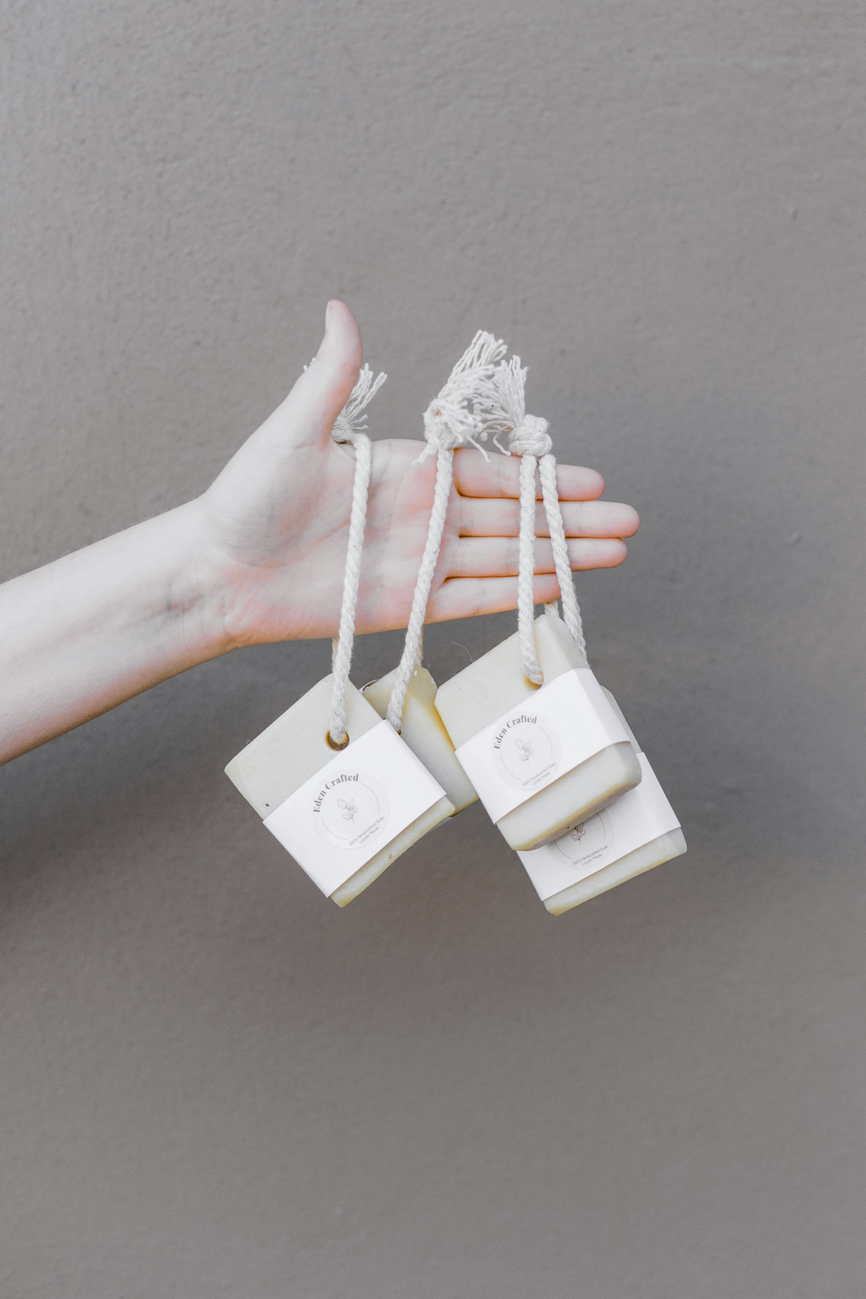 A hand holding two tags with string attached to them photo – Free Human ...