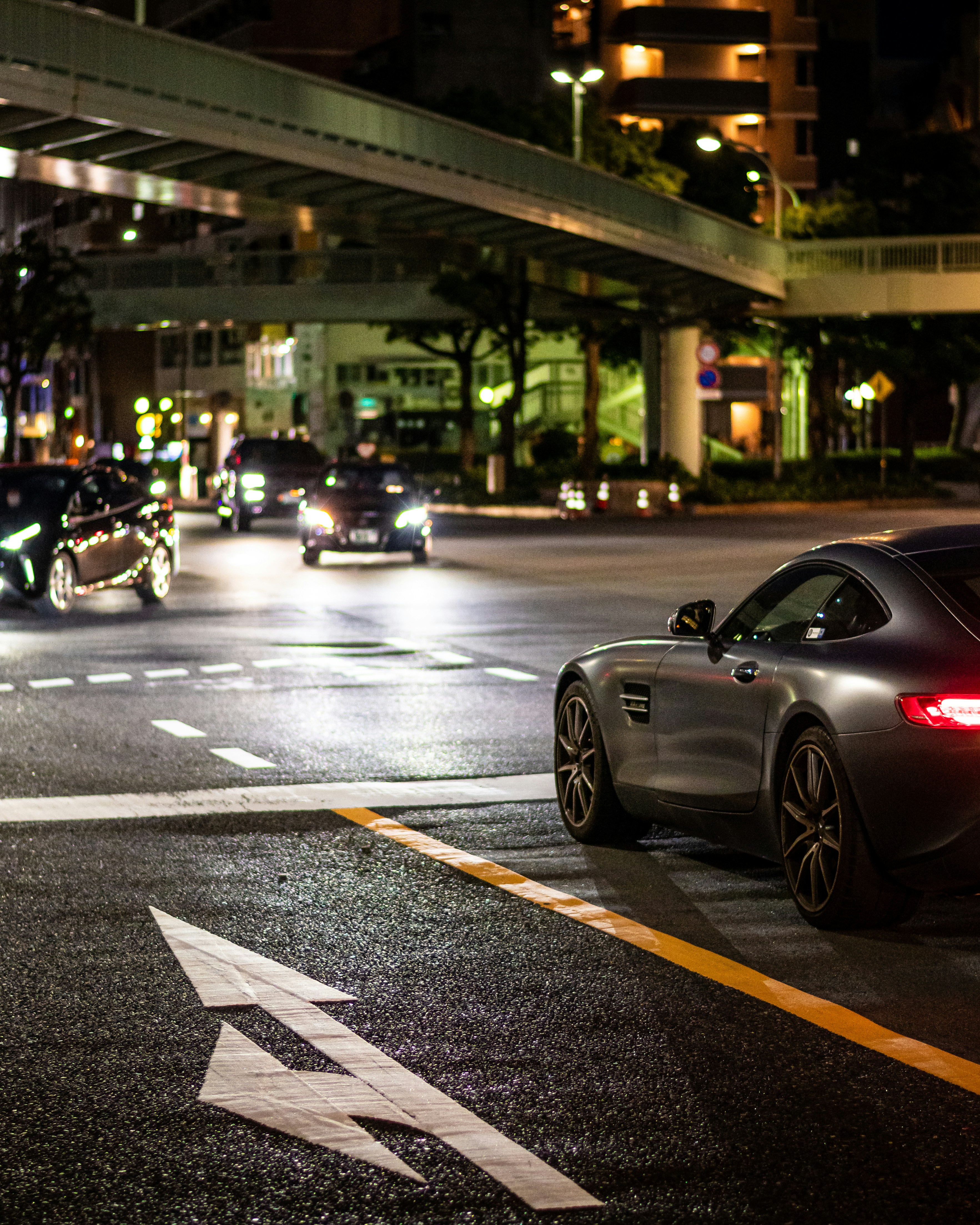 Midnight Slipstream: A Silver GT at the Edge of Neon Crosswalk