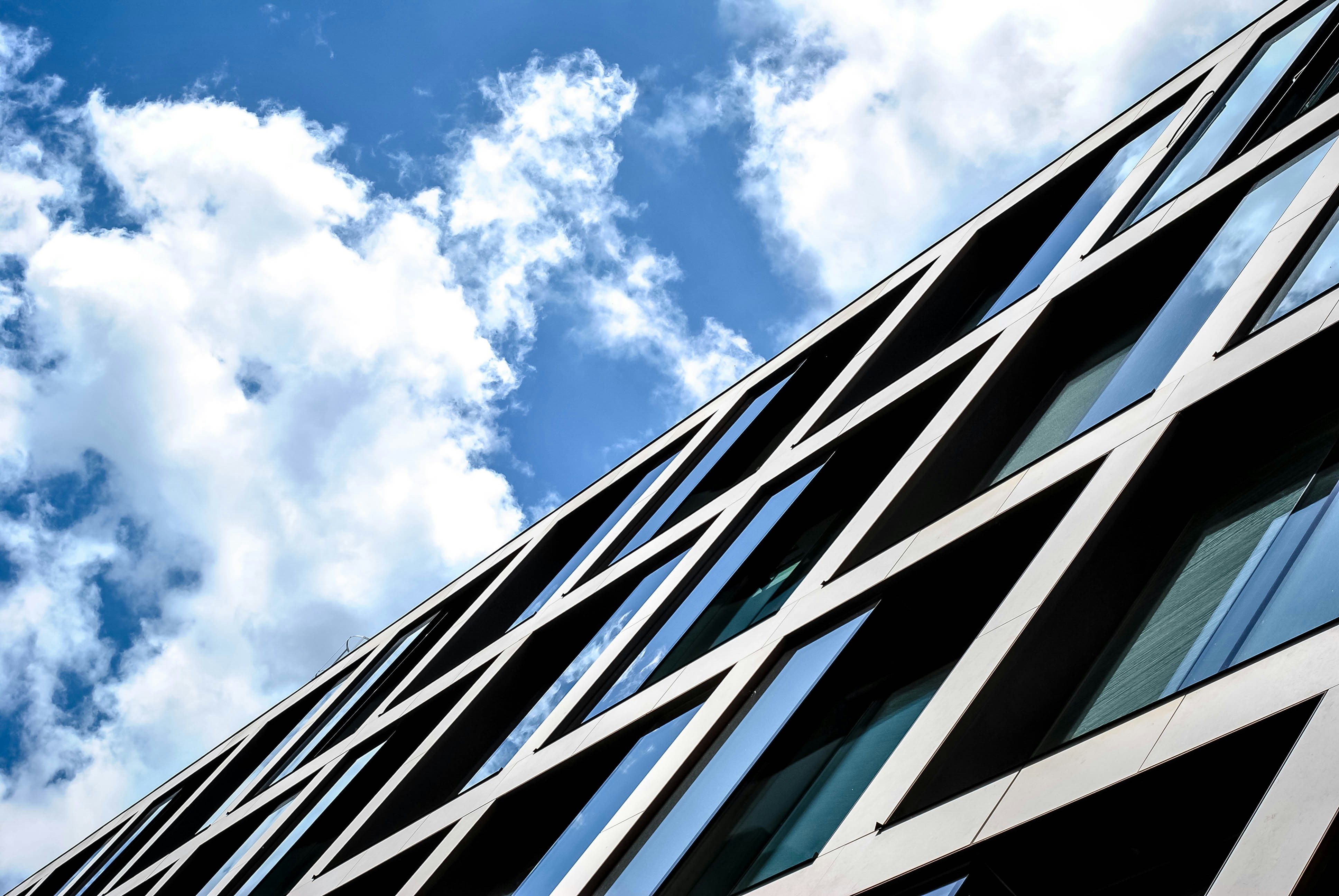 Office building in Munich | white and black concrete building under blue sky during daytime