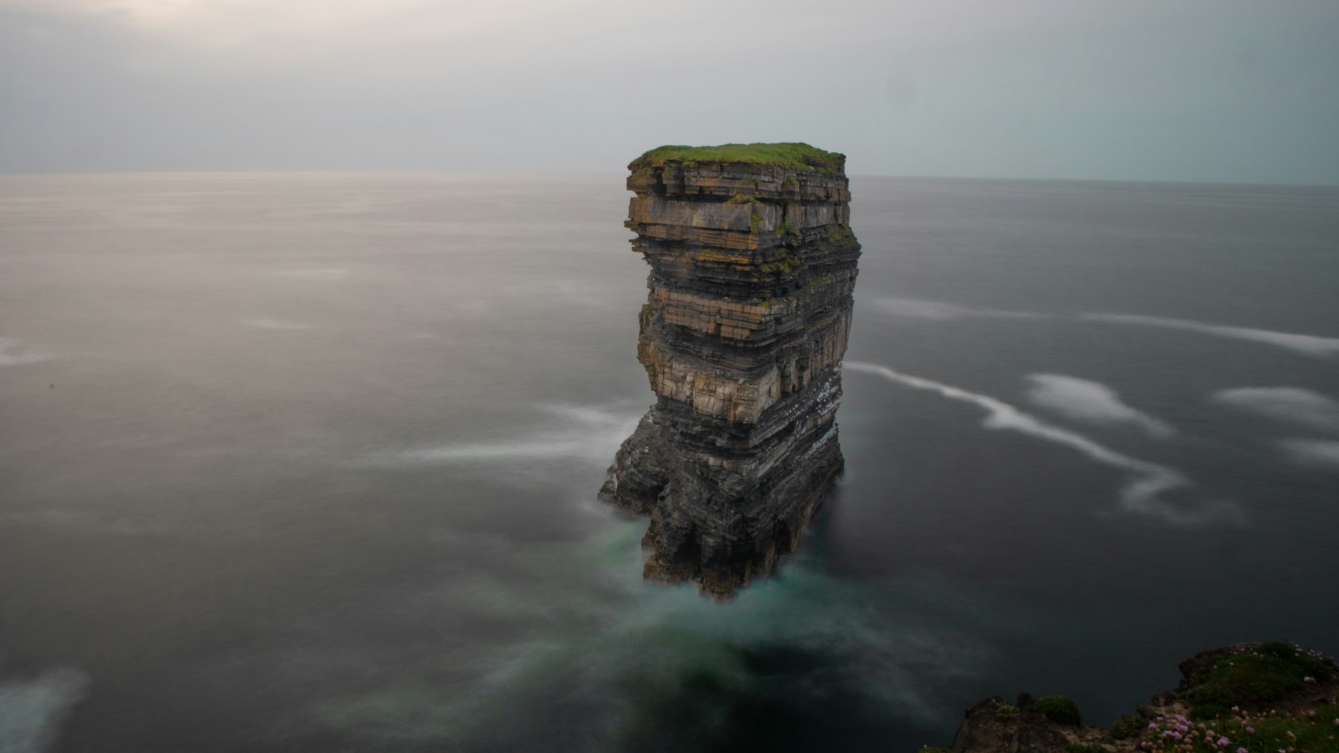 Solitary Sea Stack Standing Against a Misty Horizon