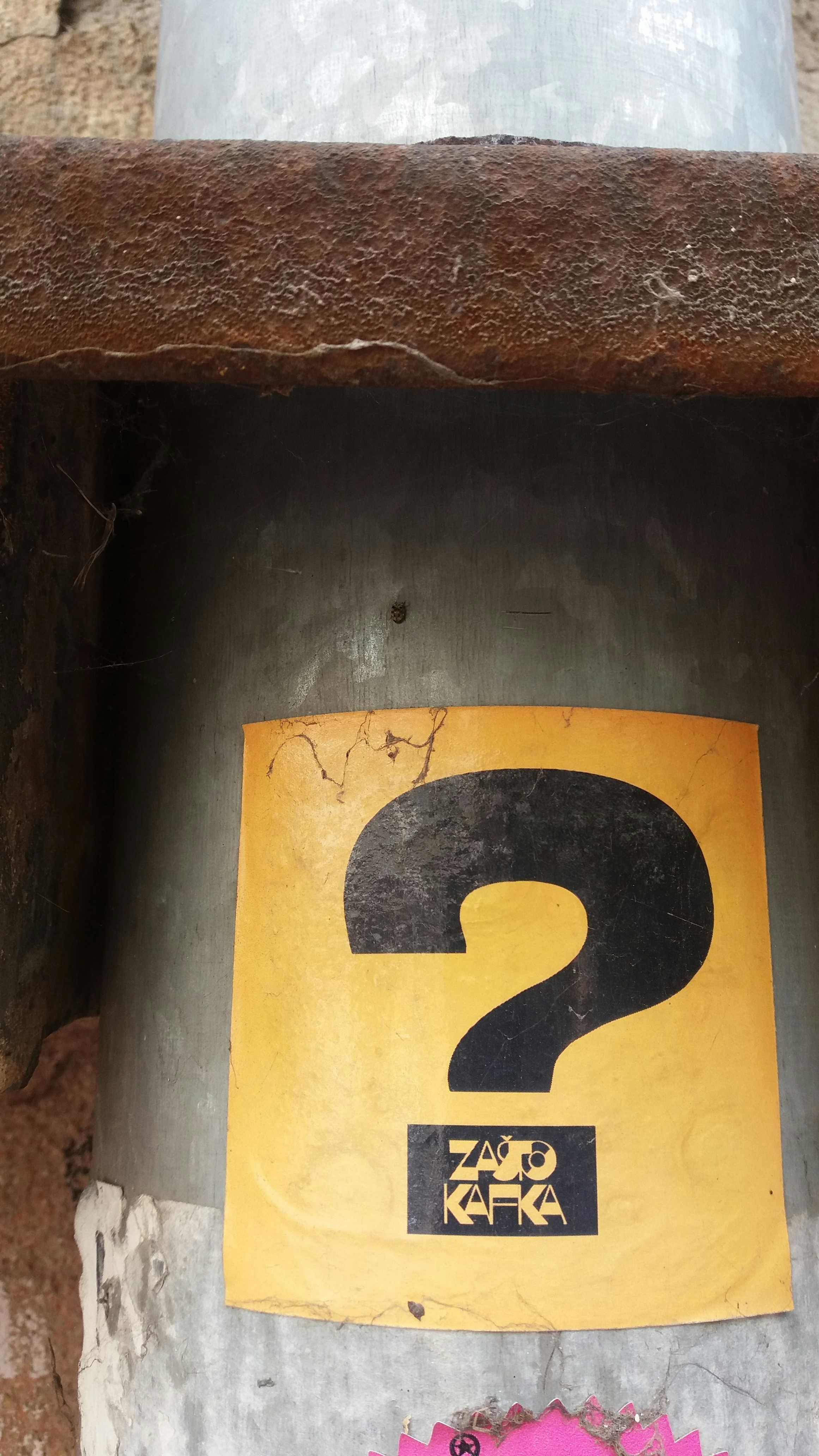 A yellow and black sign with a question mark on it photo – Free Text ...