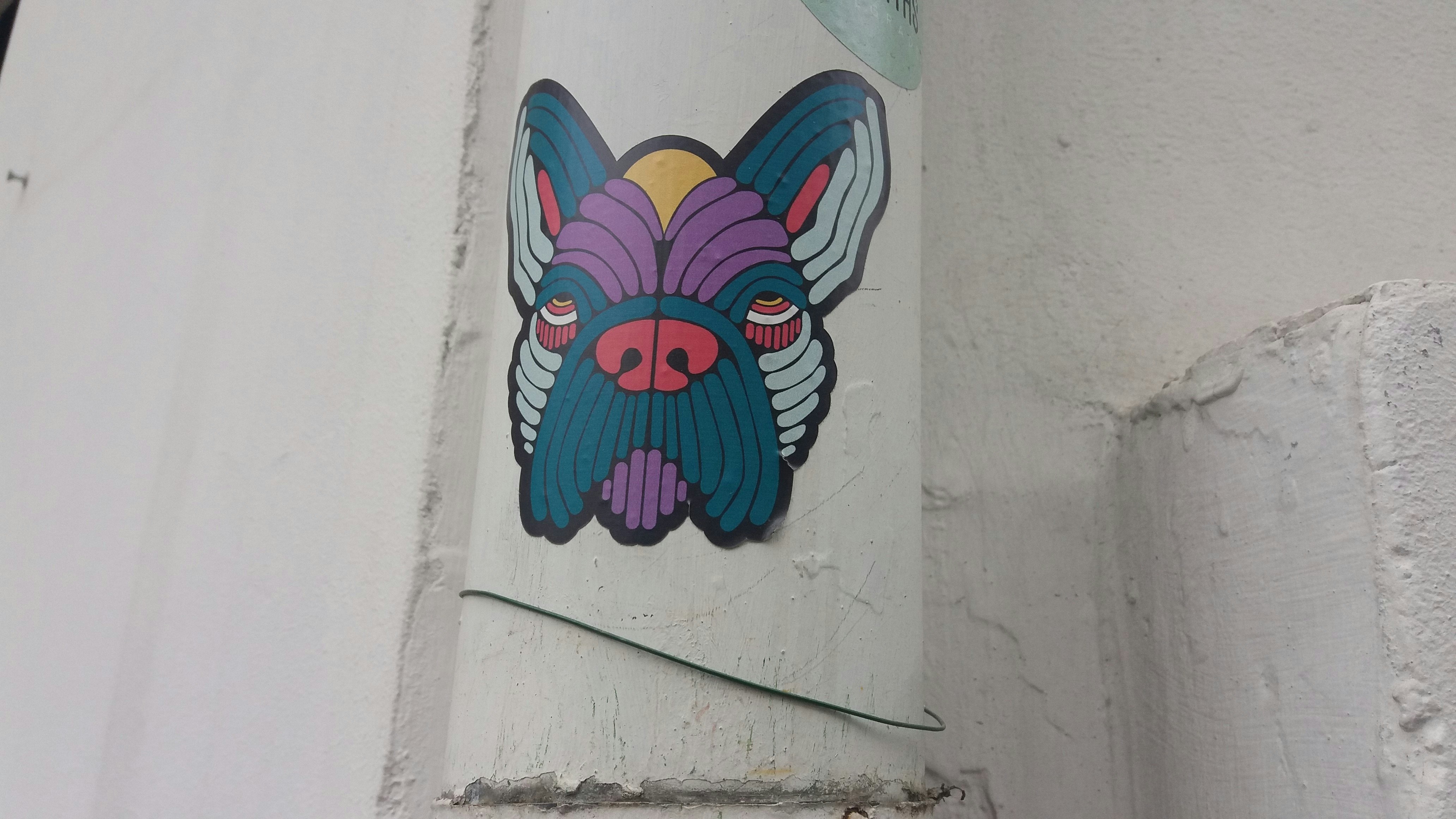 Pop Art Bulldog Sticker Gracing a Concrete Corner