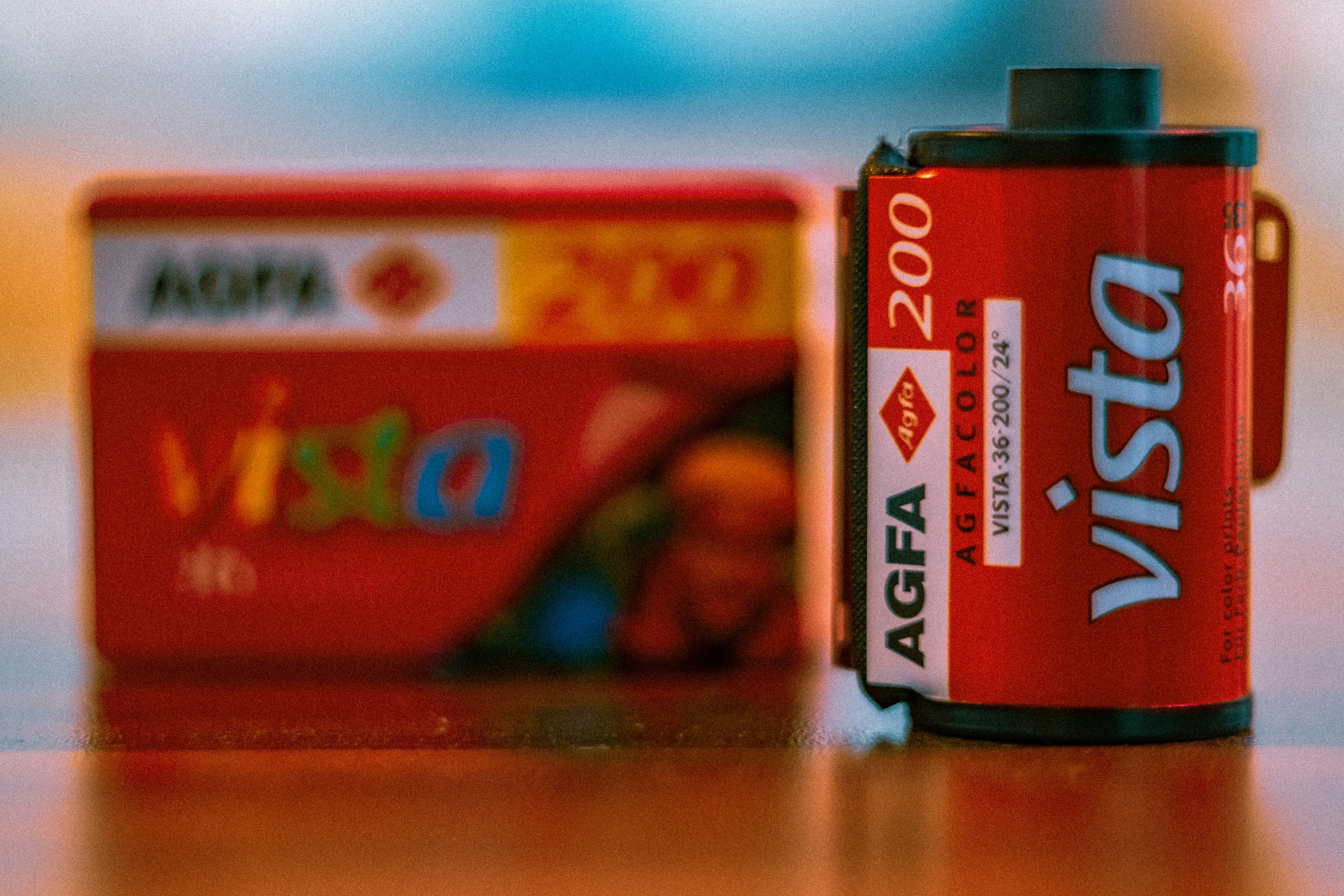 A red can of soda next to a red box photo – Free Agfa film Image on ...