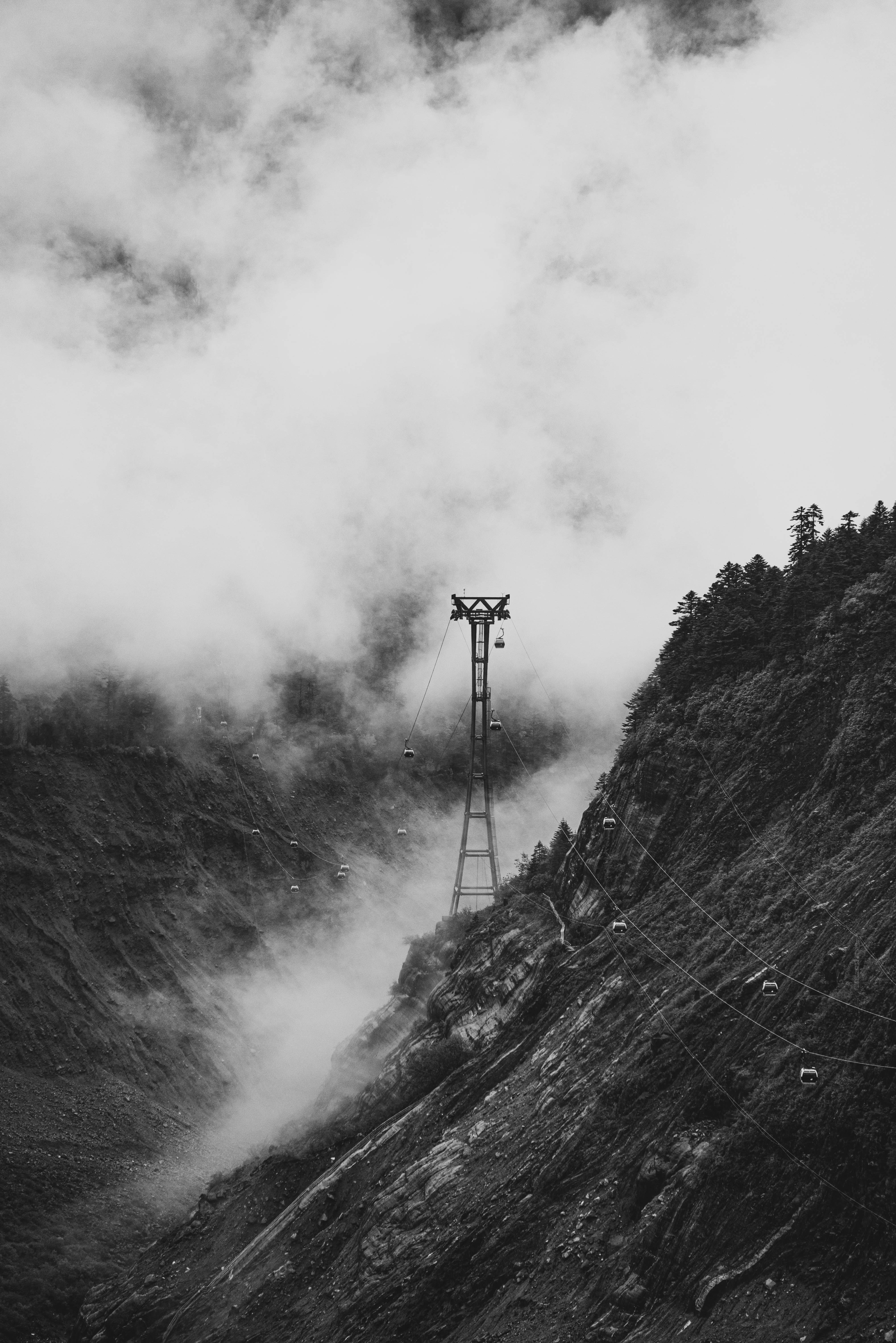 Cable Car Sentinel: A Mountain Pass Wrapped in Fog