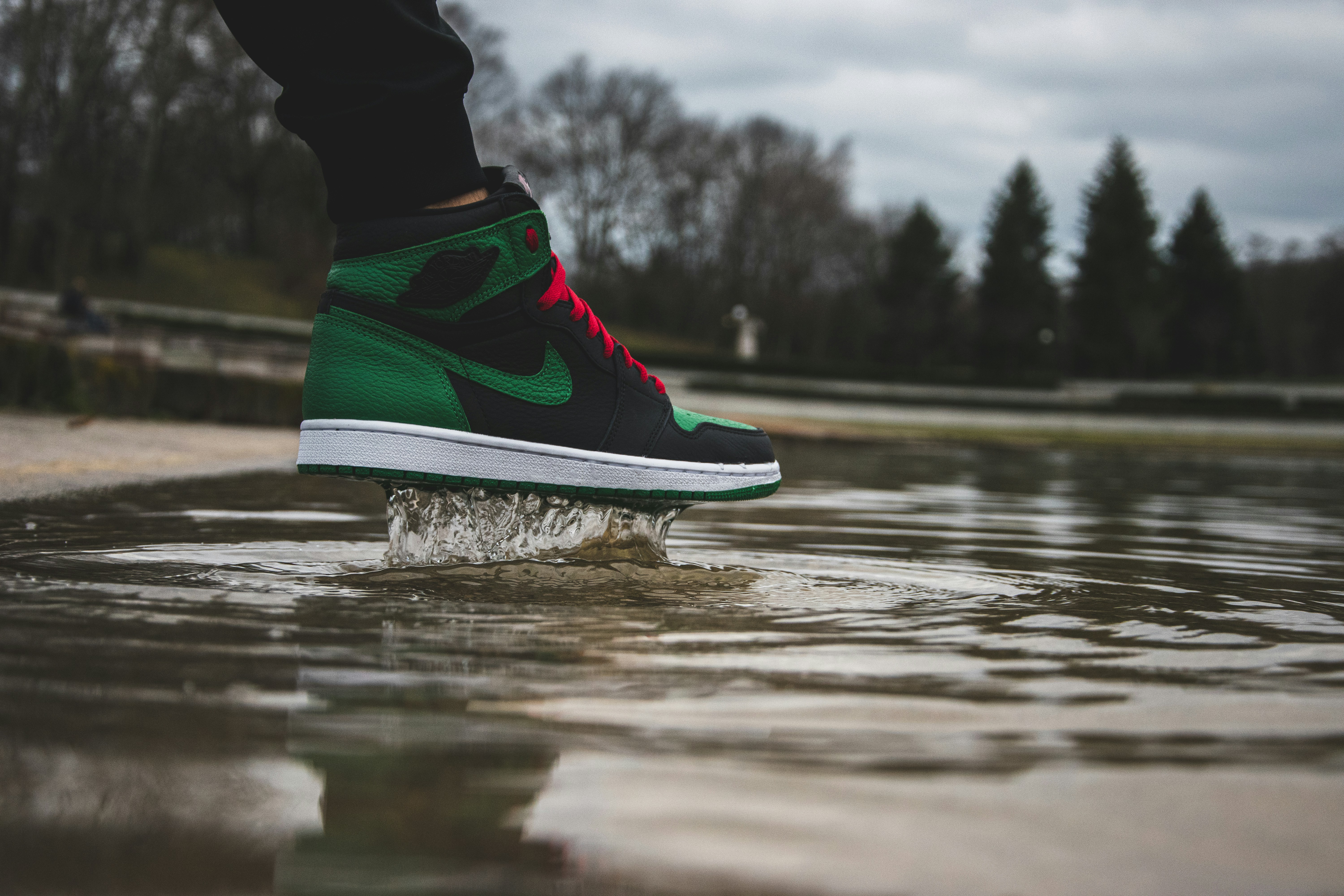 a person standing on top of a puddle of water