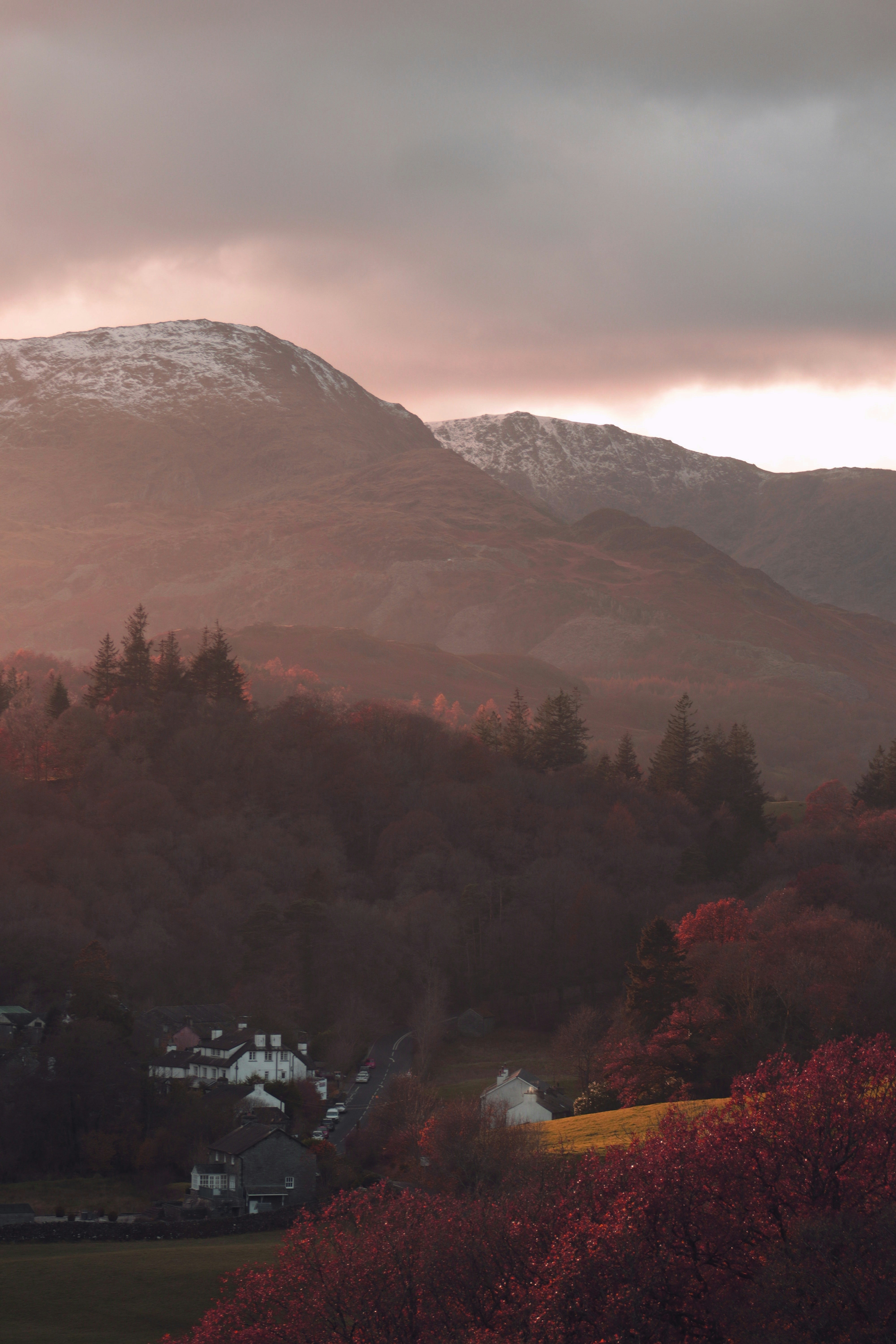Dawn Over the Red Valley: Mountain Range Meets Quiet Village