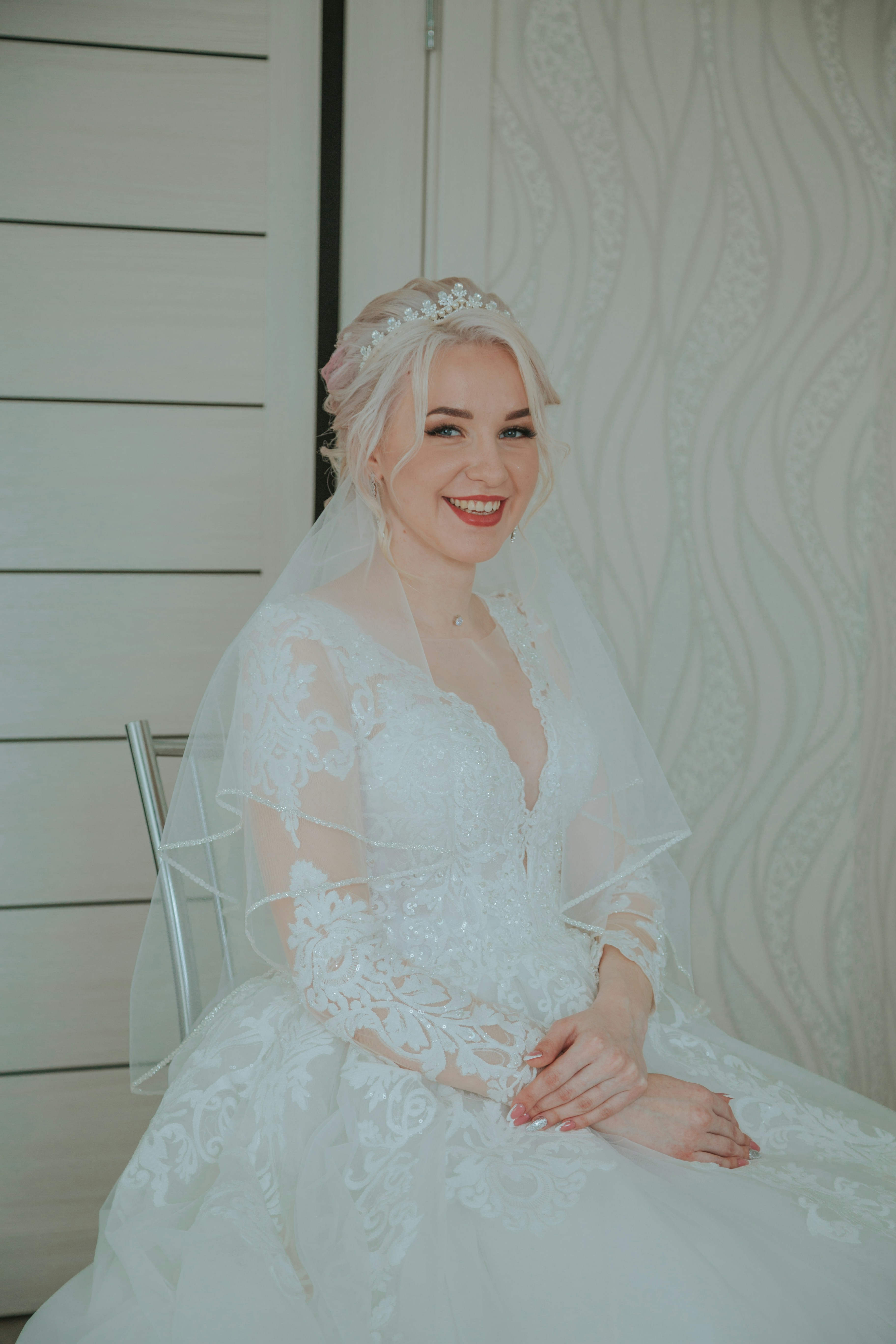 Glimmer of Joy: Bride in Lace Beneath Soft Interior Light