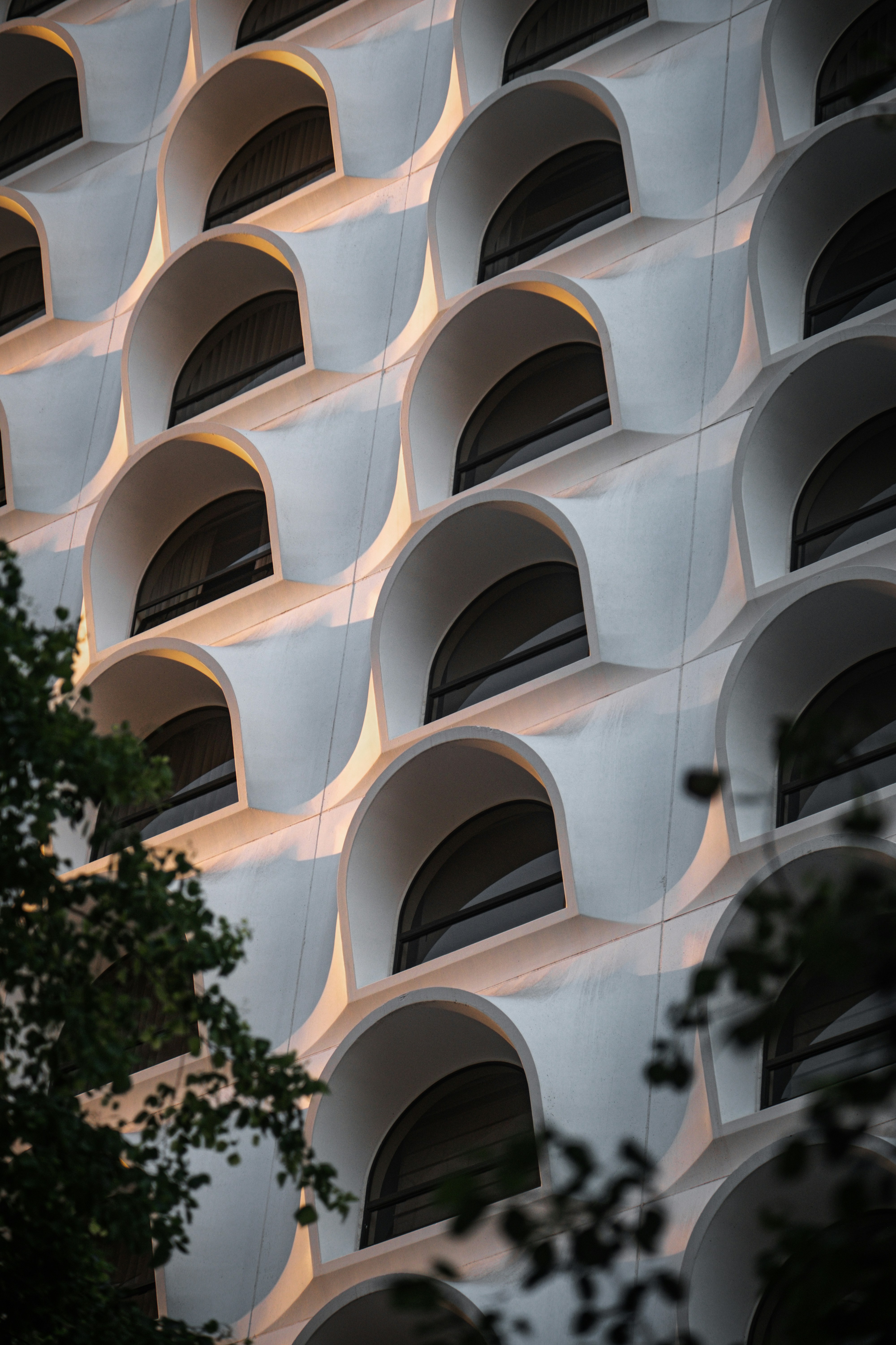 Arched Symmetry: A Windowed Facade in Golden Hour Light