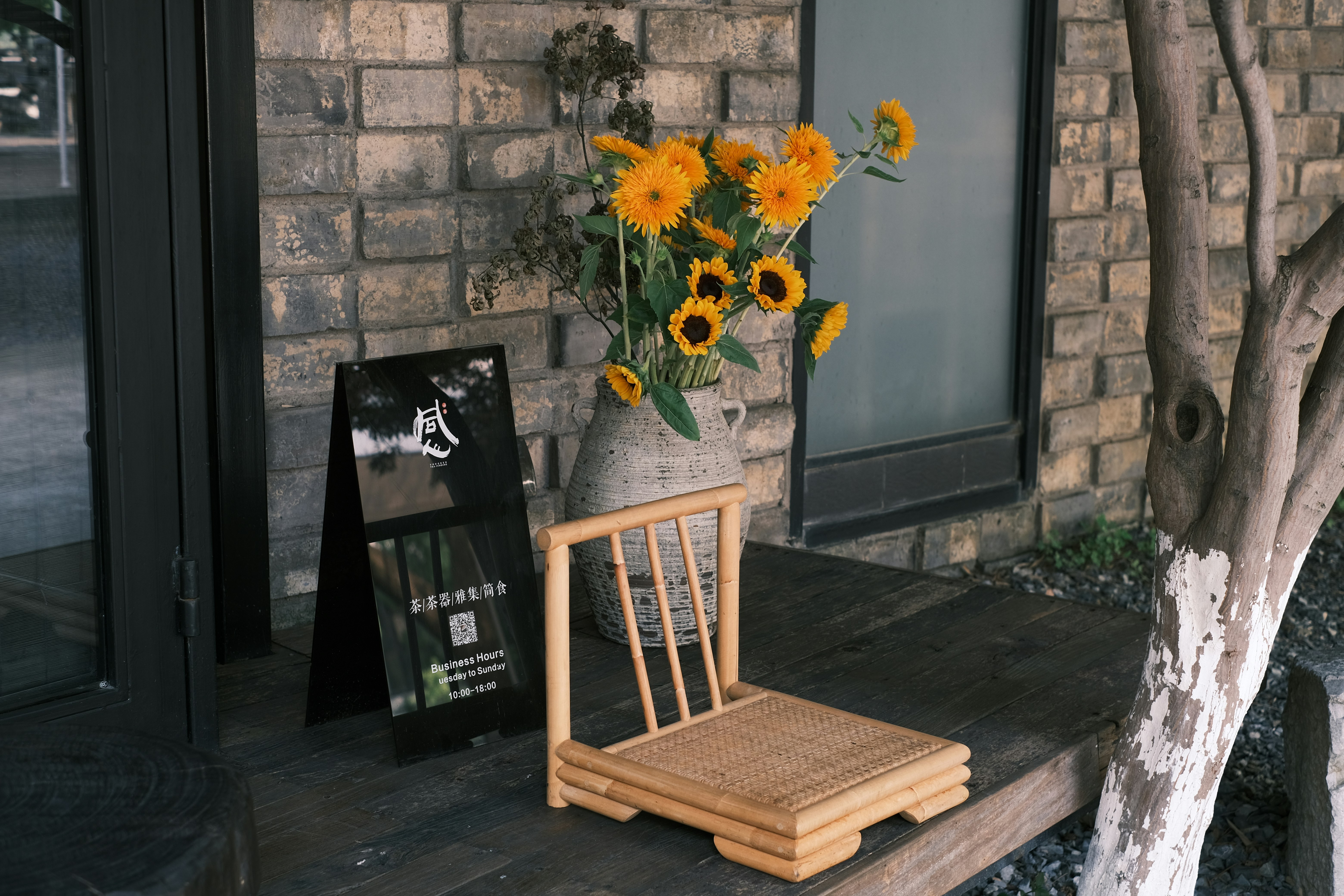 Sunflowers by the Porch: A Quiet Rustic Moment at the Entrance