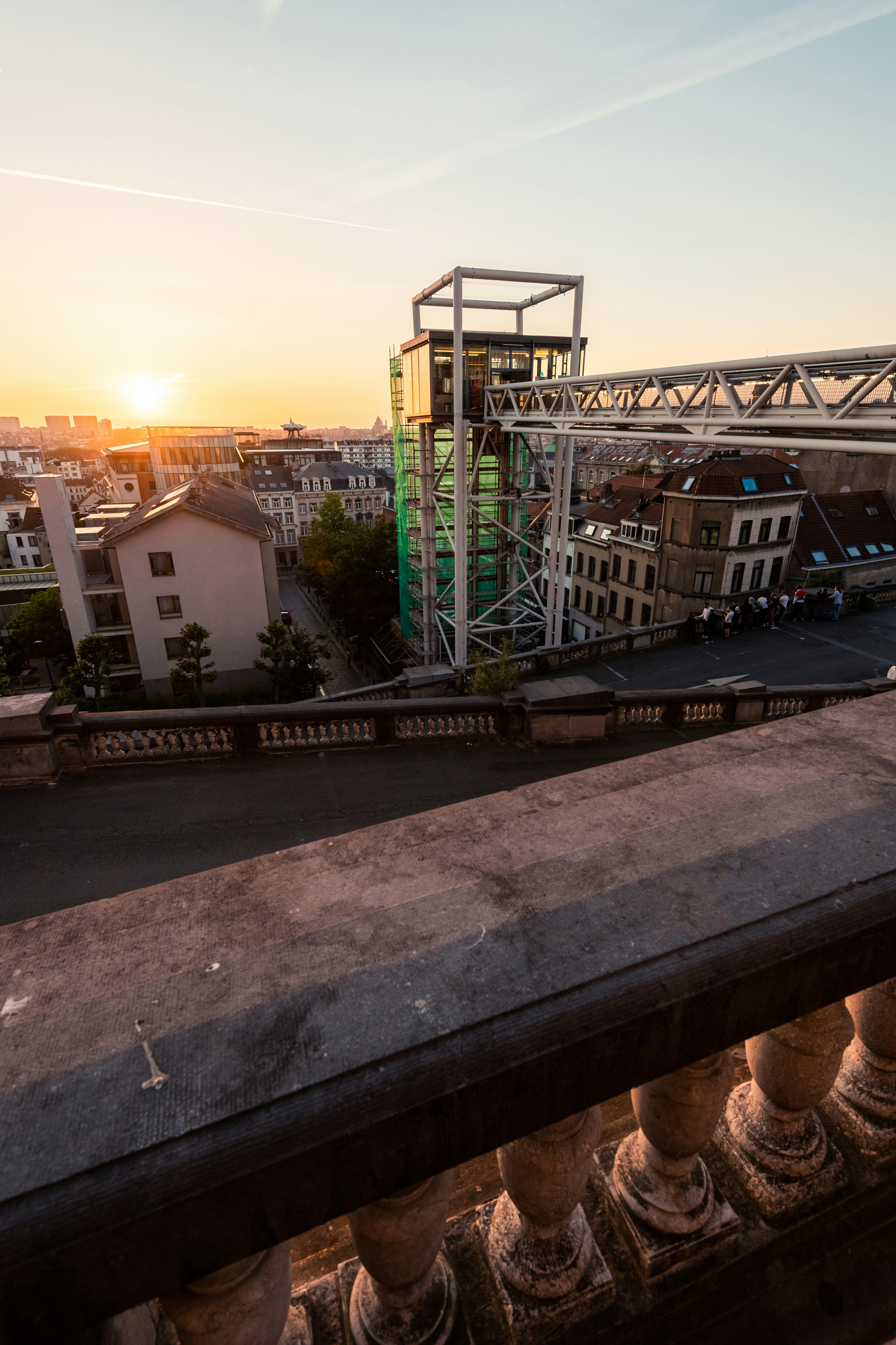 The sun is setting over a city with tall buildings photo – Free ...
