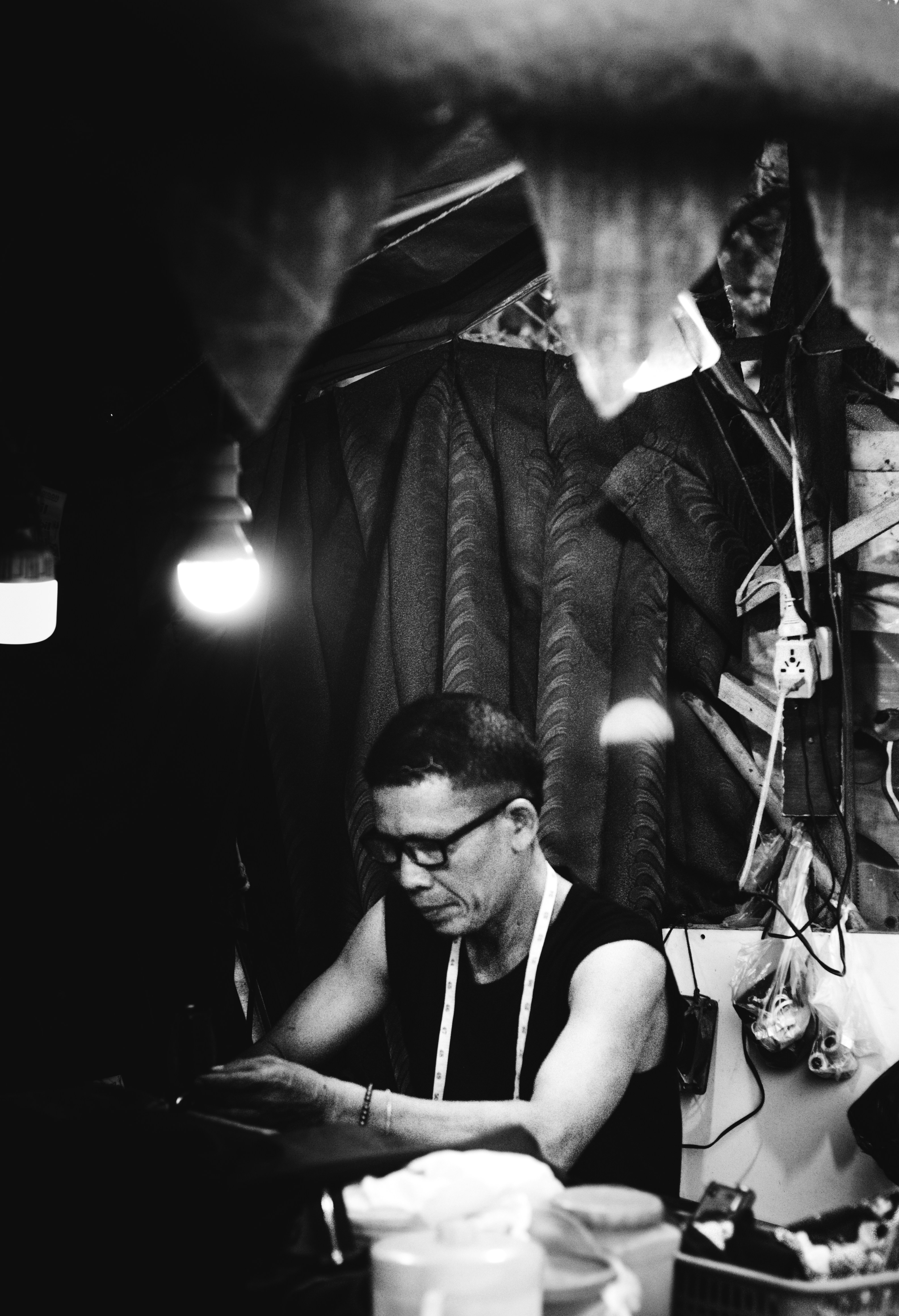 Sole Designer in a Backroom: Crafting Garments by Lamp Light