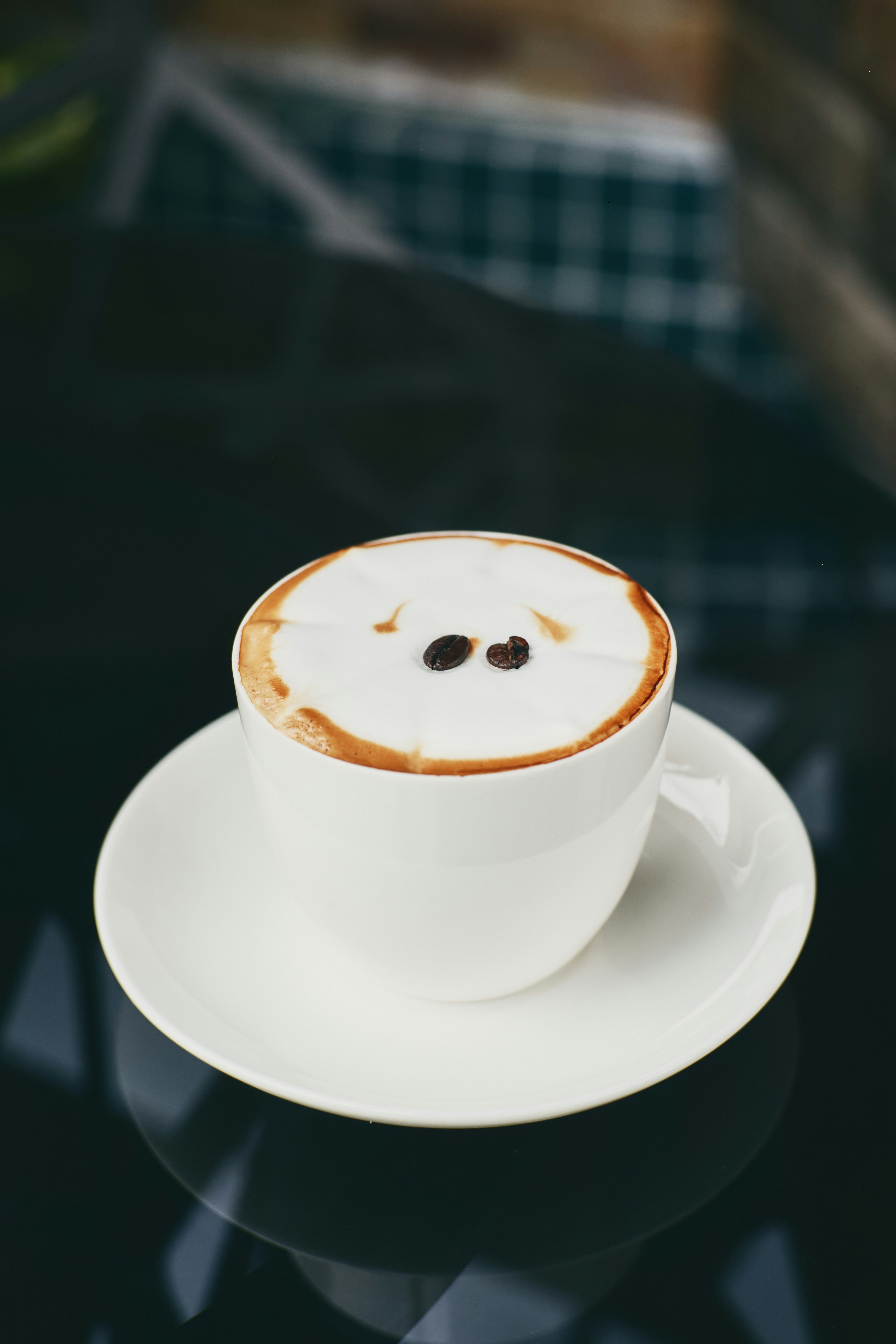Two Beans on White Foam: A Minimalist Café Moment