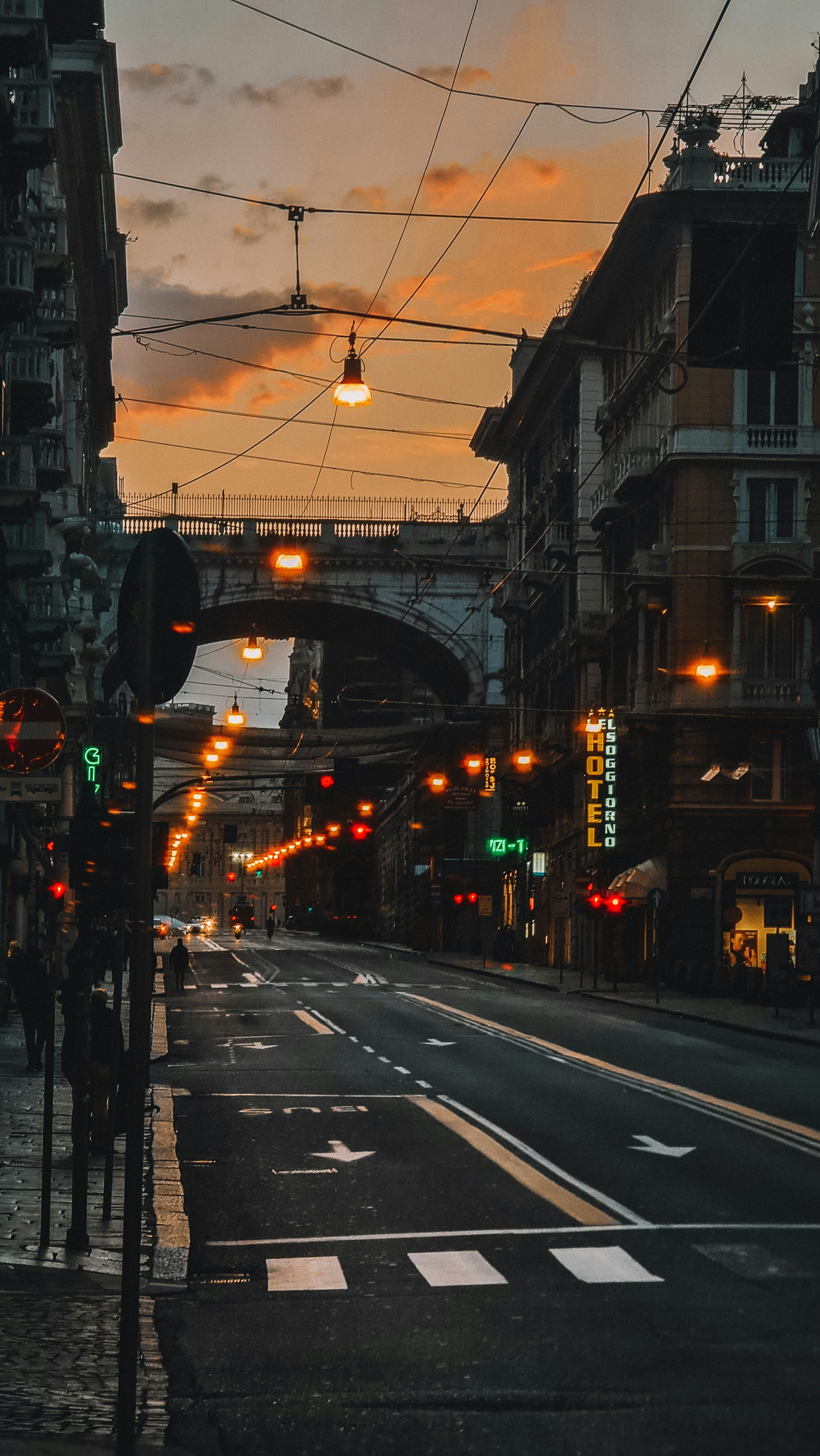 Amber Dusk Over a Tangle of Wires on a City Street