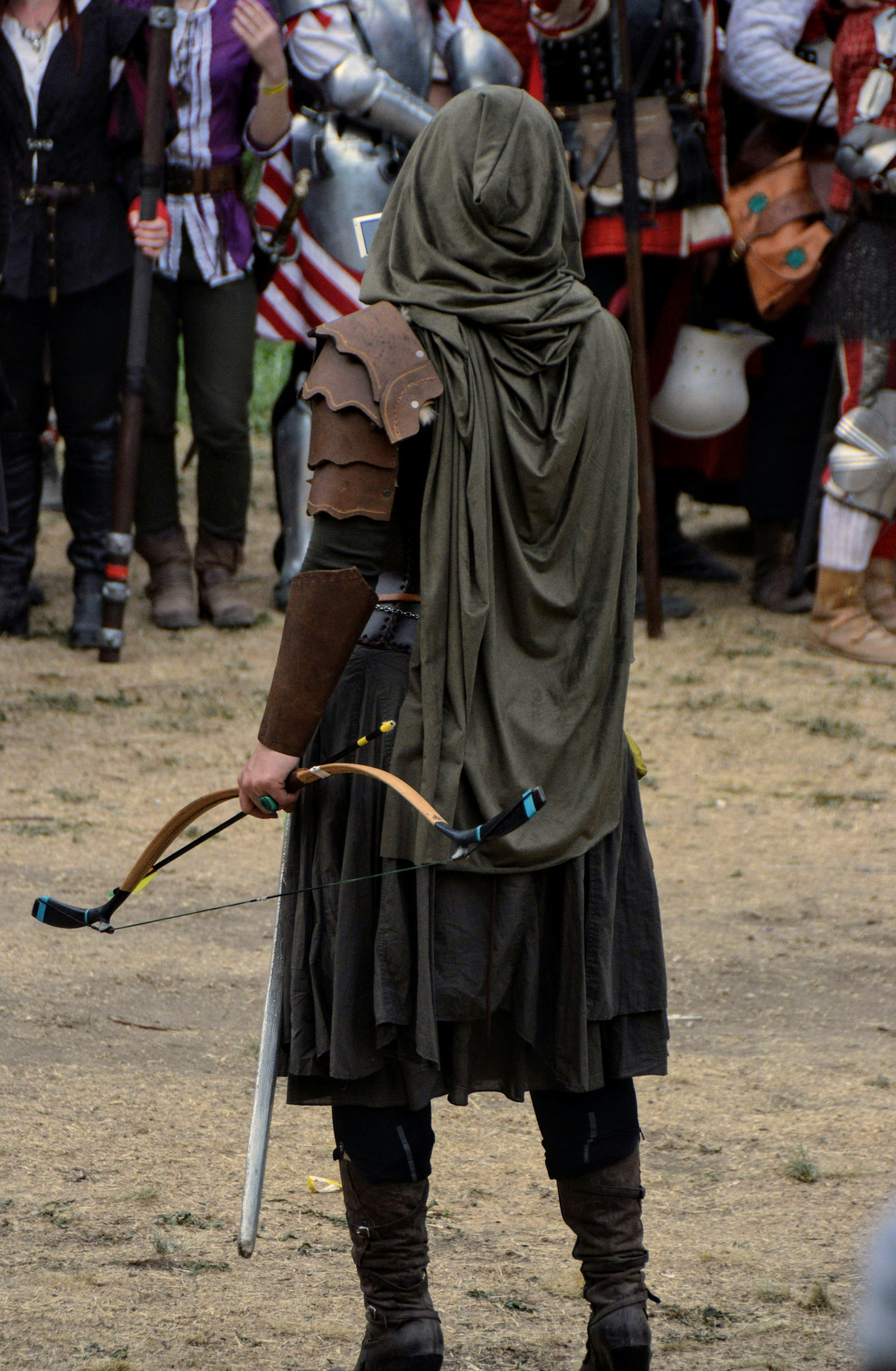 Warrior in the Round: A Cloaked Archer Gathers with a Recurve