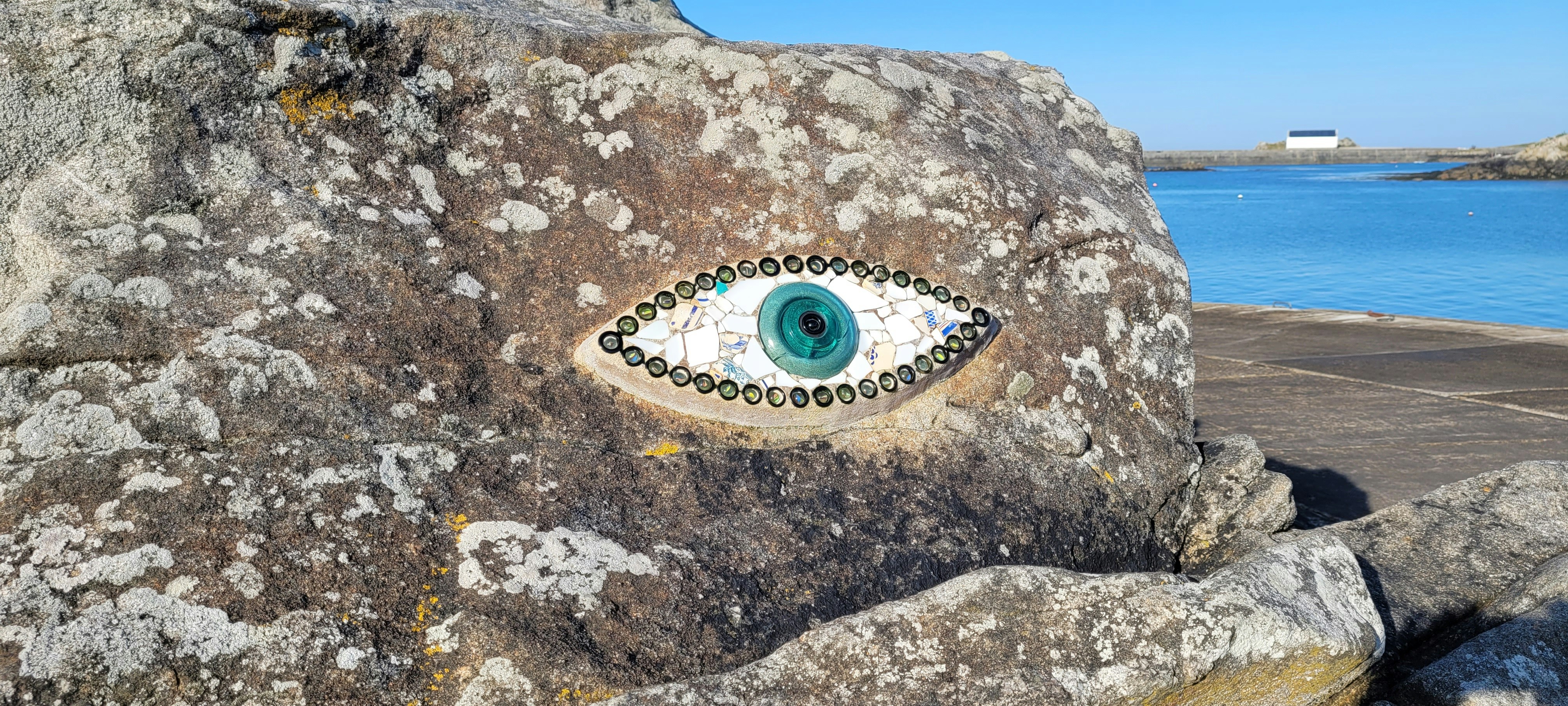 Mosaic Eye on Coastal Stone