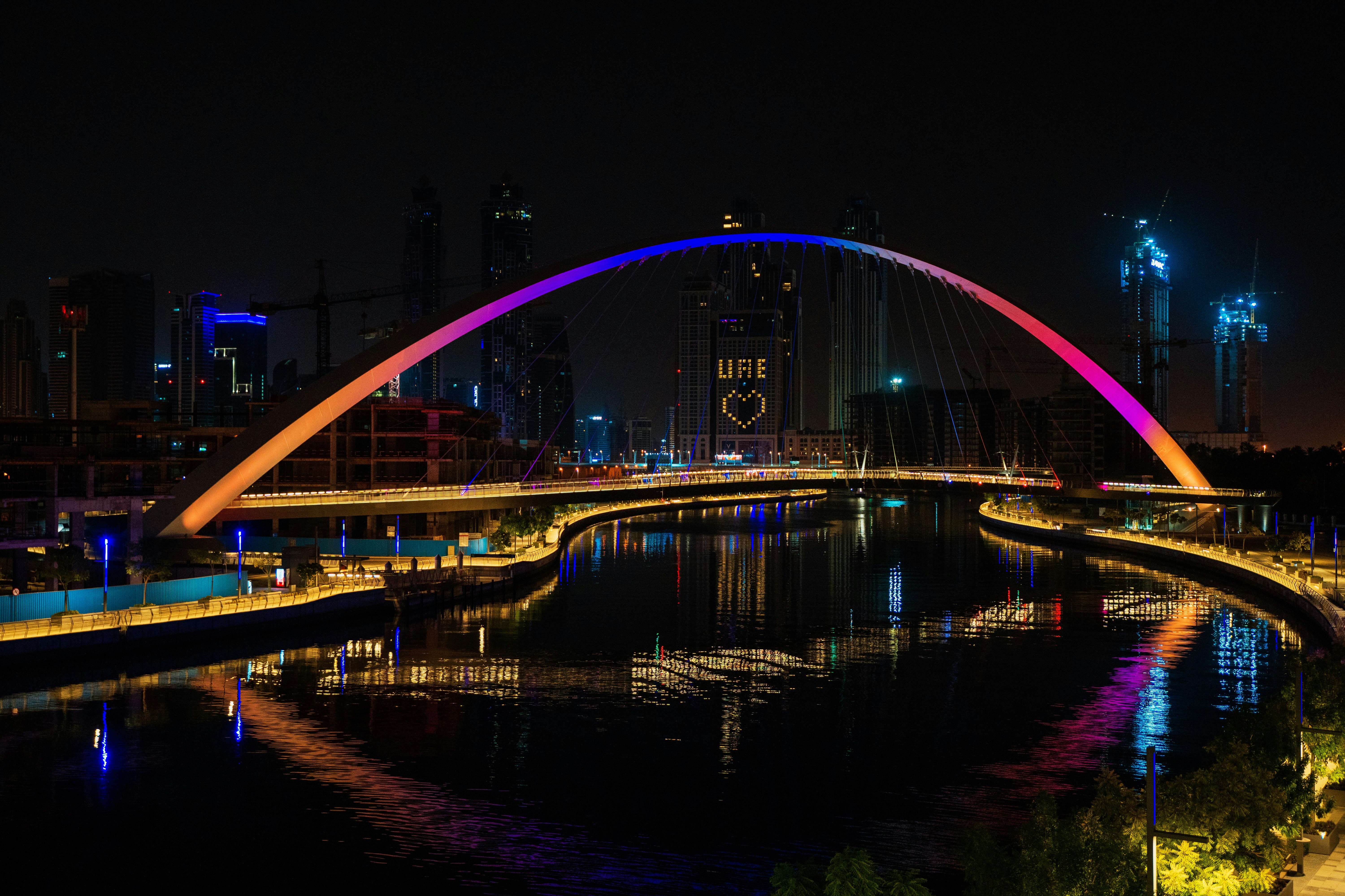 Lighted bridge over body of water during nighttime photo – Free ...