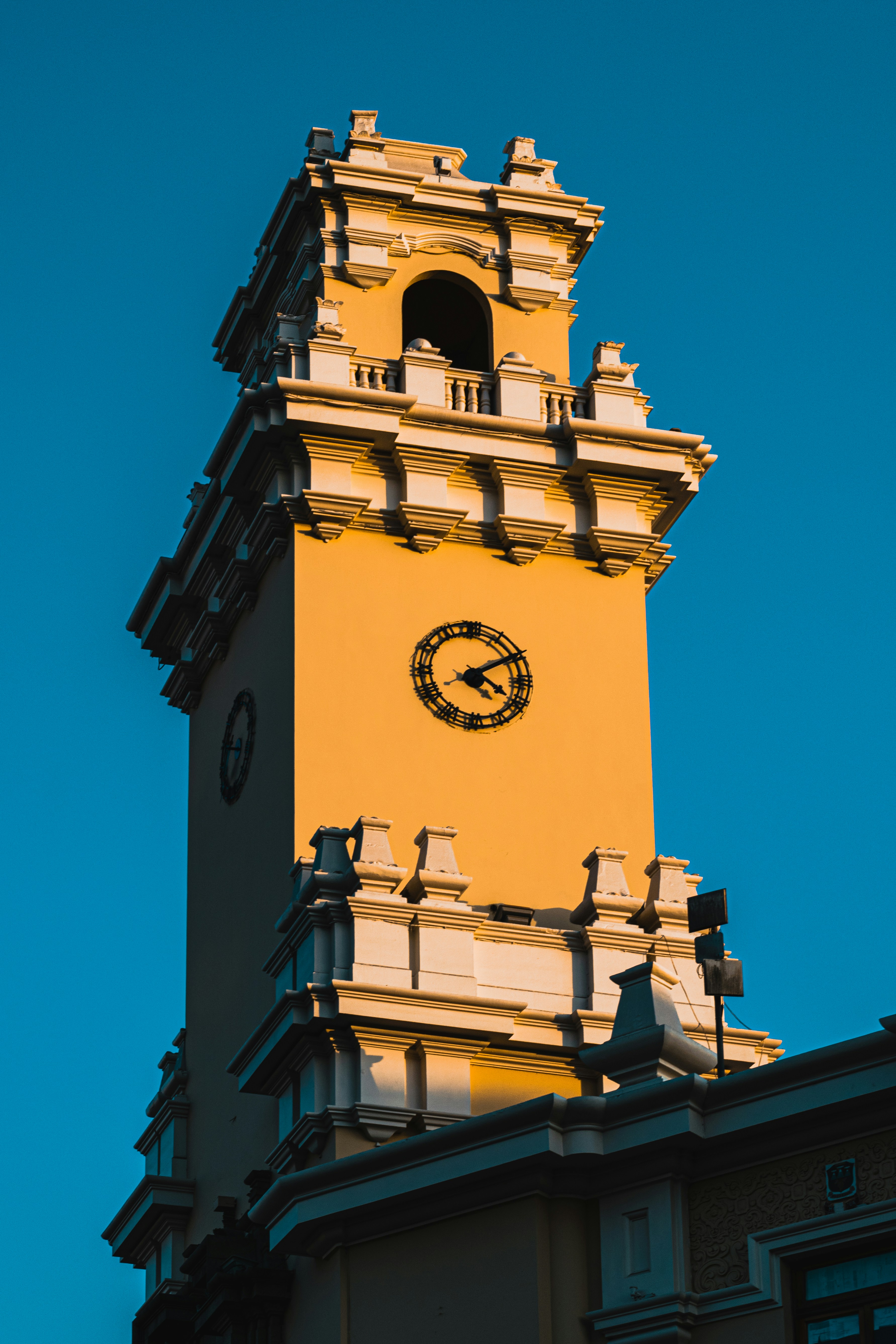 Chiming Time: A Clocktower Bathed in Sunset Blue