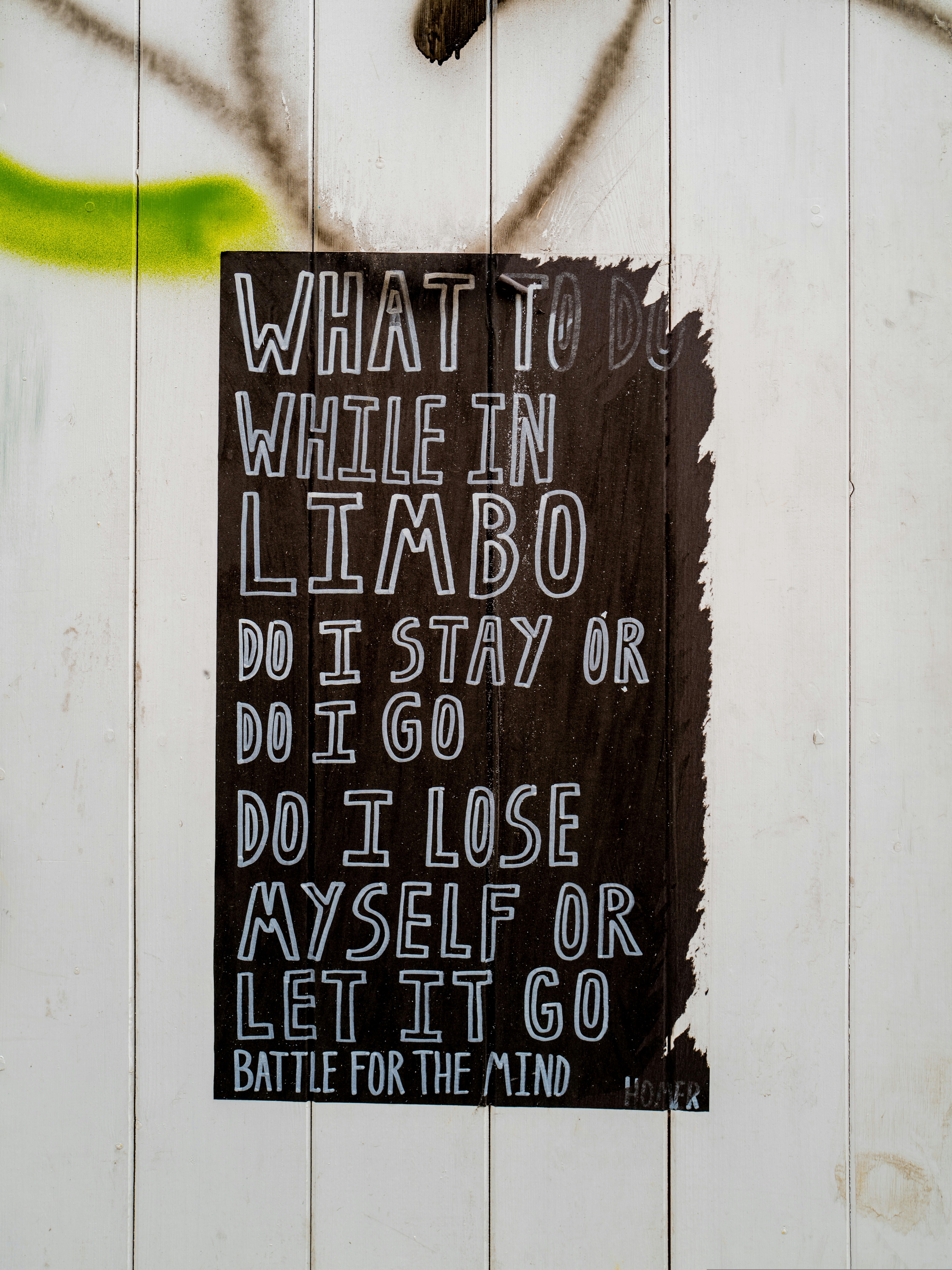 A sign on the side of a building that says what to write in limbo photo ...