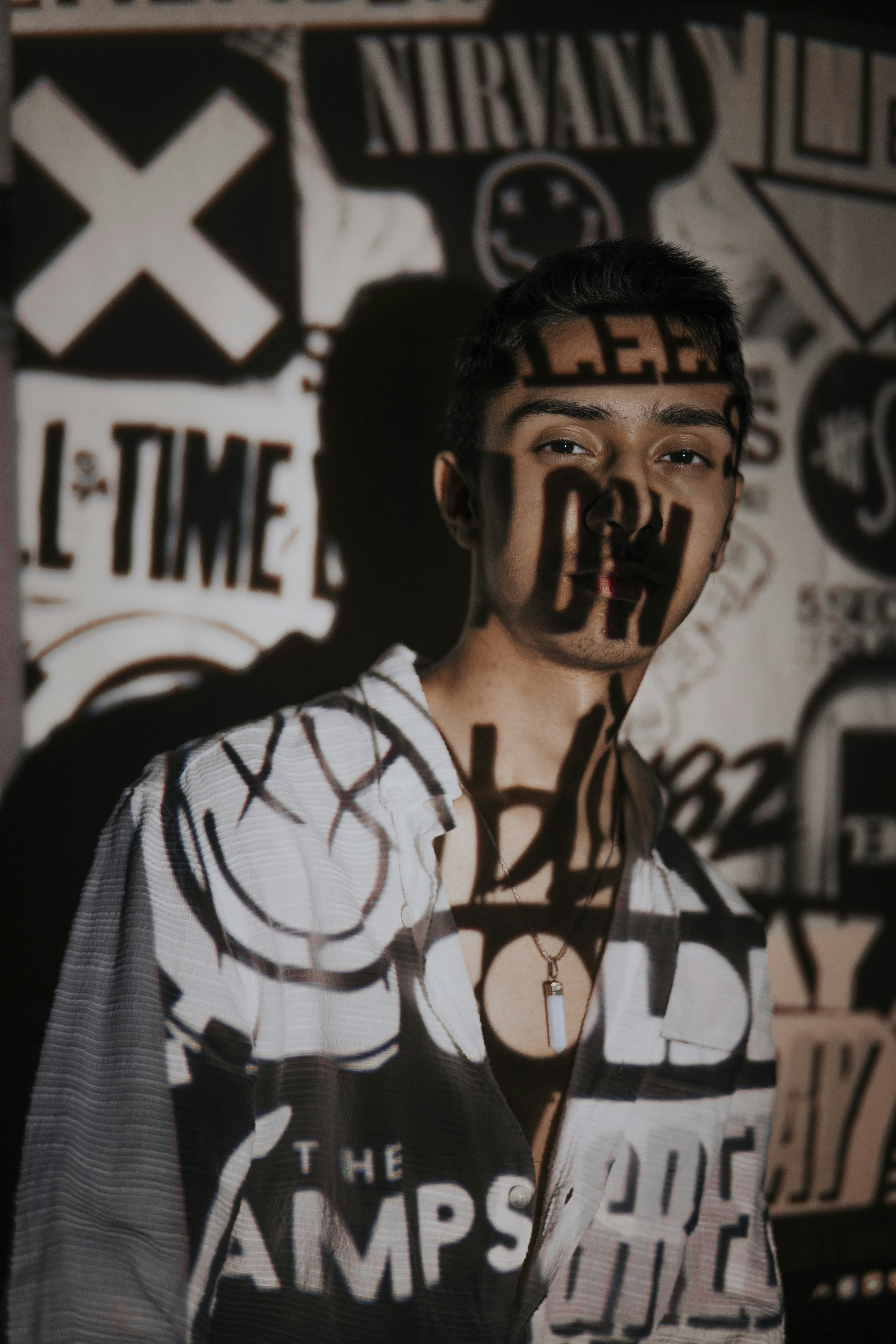 Shadow Script Portrait: Graffiti Projections on a Youthful Face