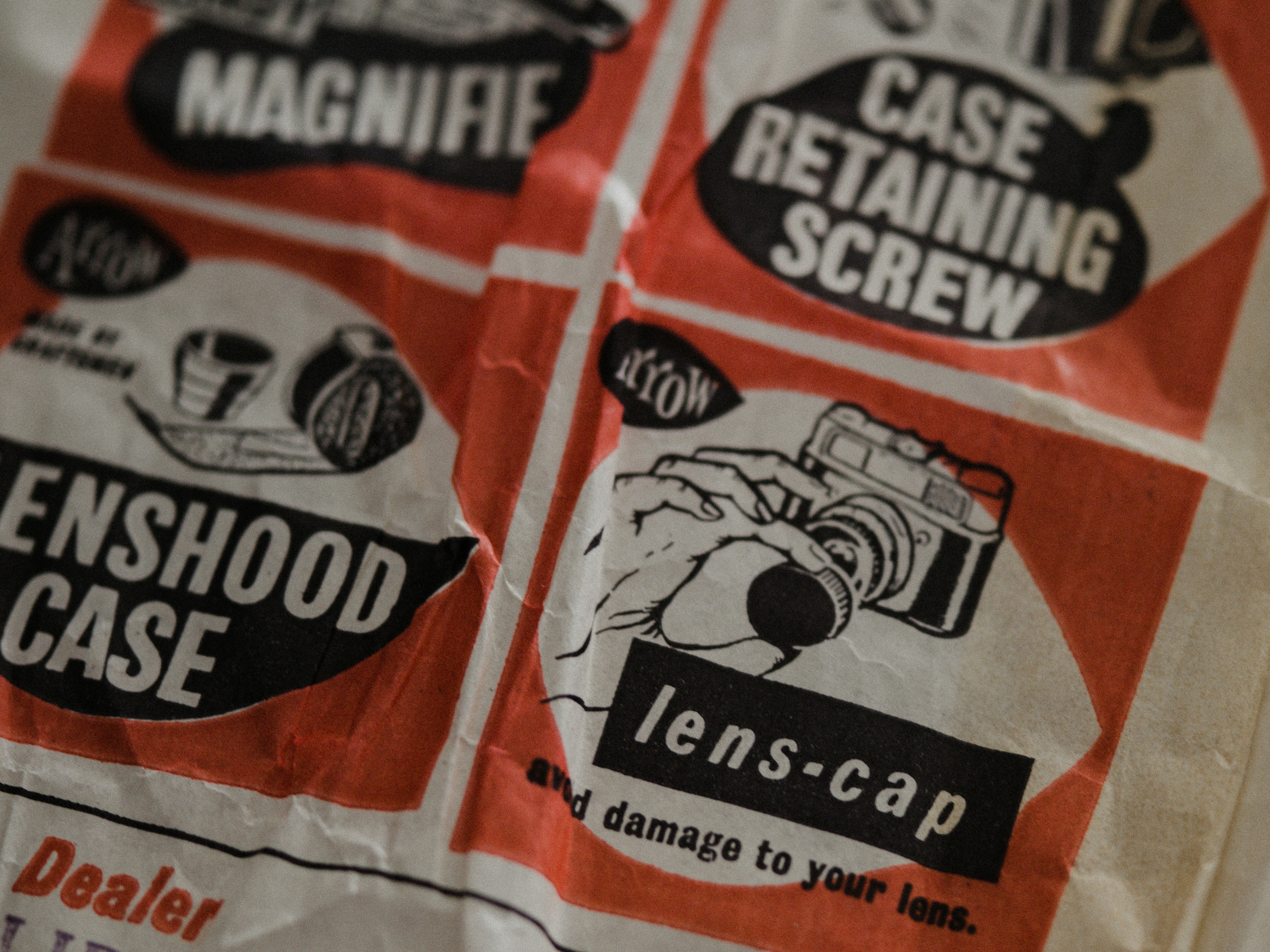 Close-up of Vintage Lens-care Packaging with Bold Logos