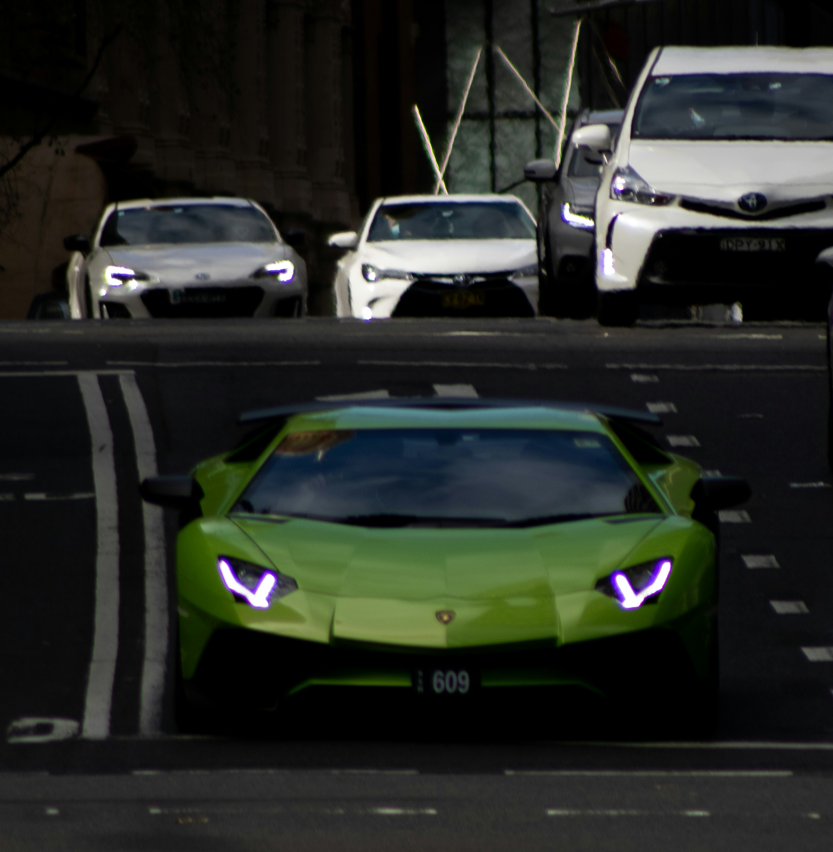 Green and black lamborghini aventador parked on parking lot during ...