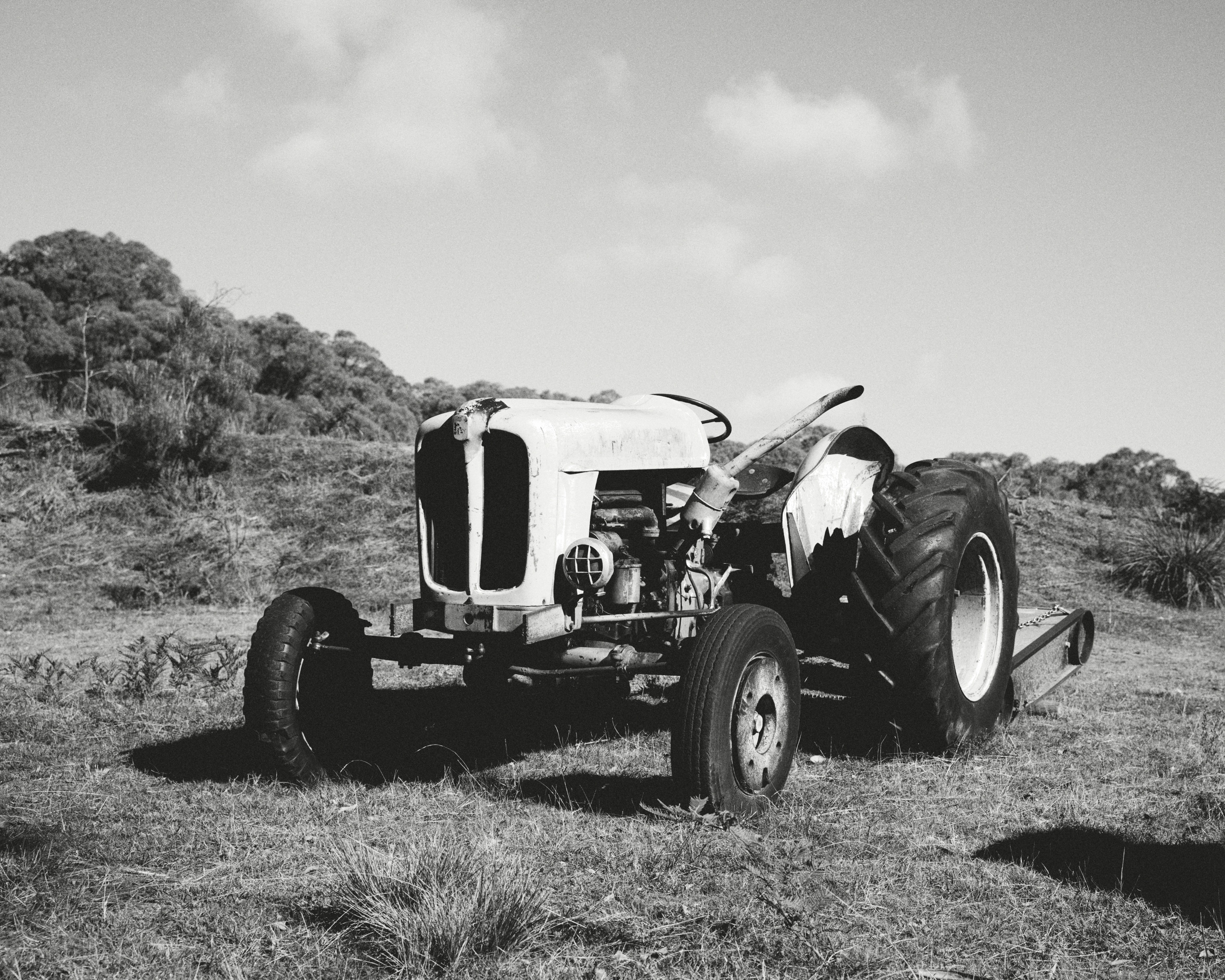 Grayscale photo of tractor on grass field photo – Free Australia Image ...