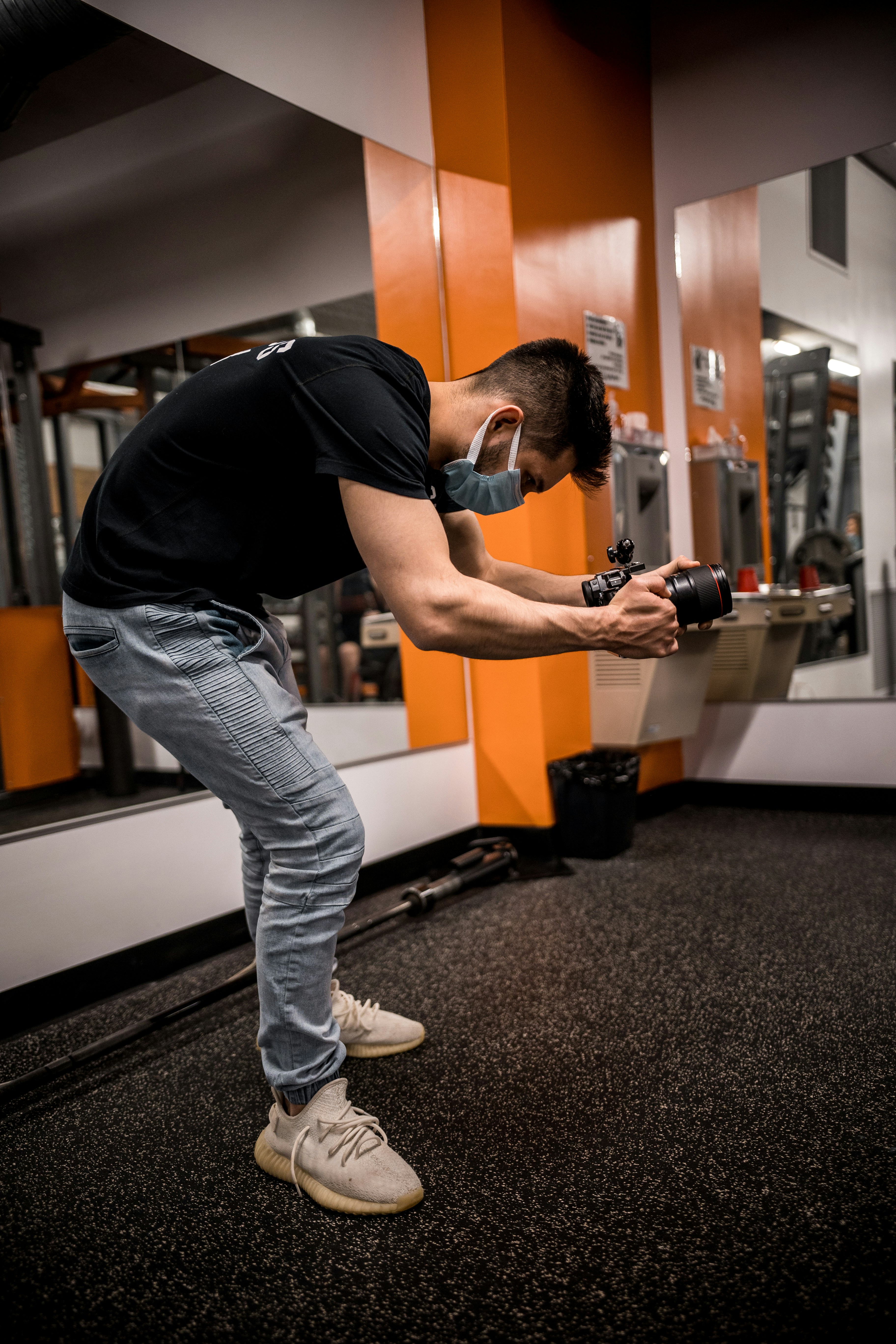 Man in black t-shirt and blue denim jeans doing exercise photo – Free ...