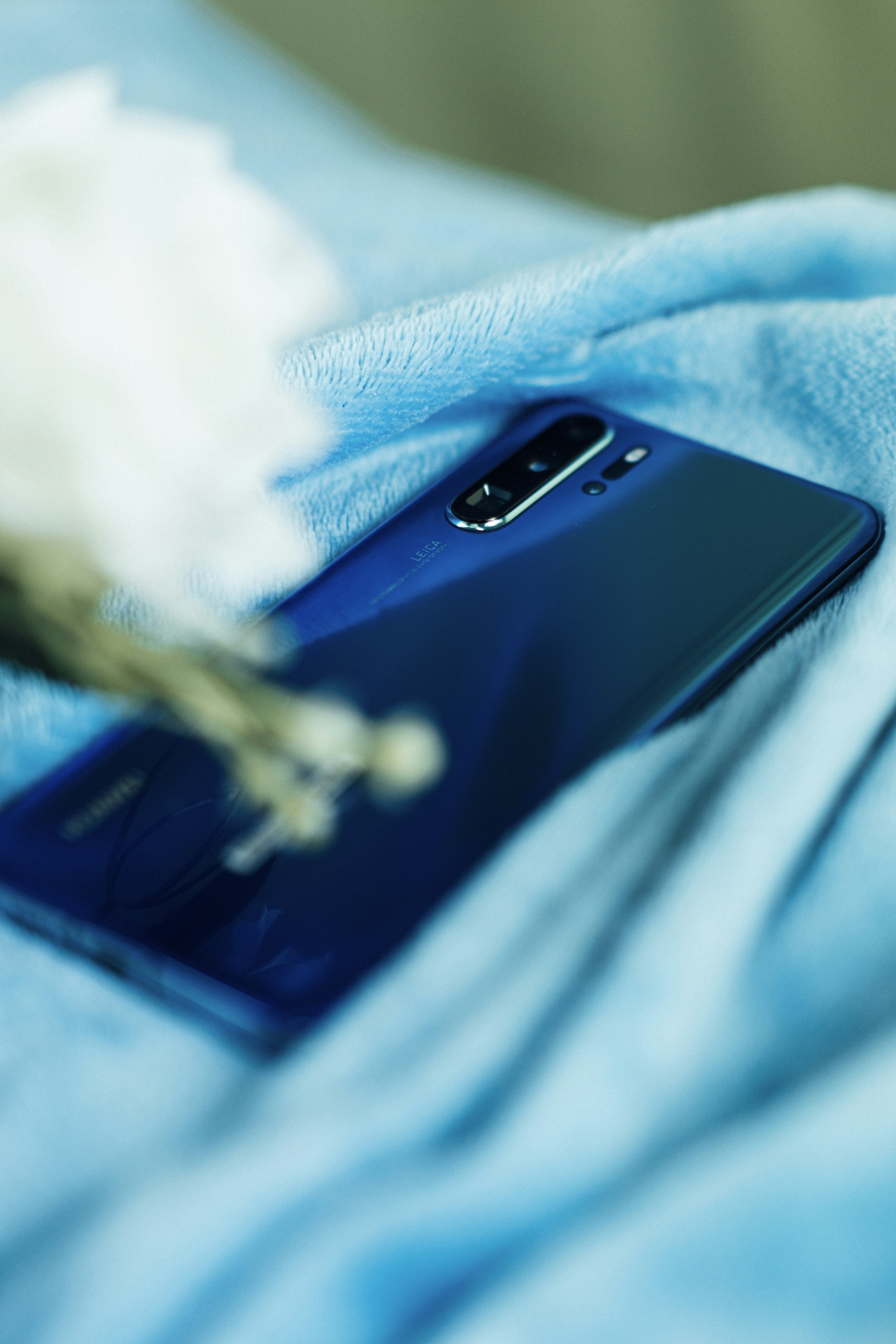 Black samsung android smartphone on white textile photo – Free Blue ...