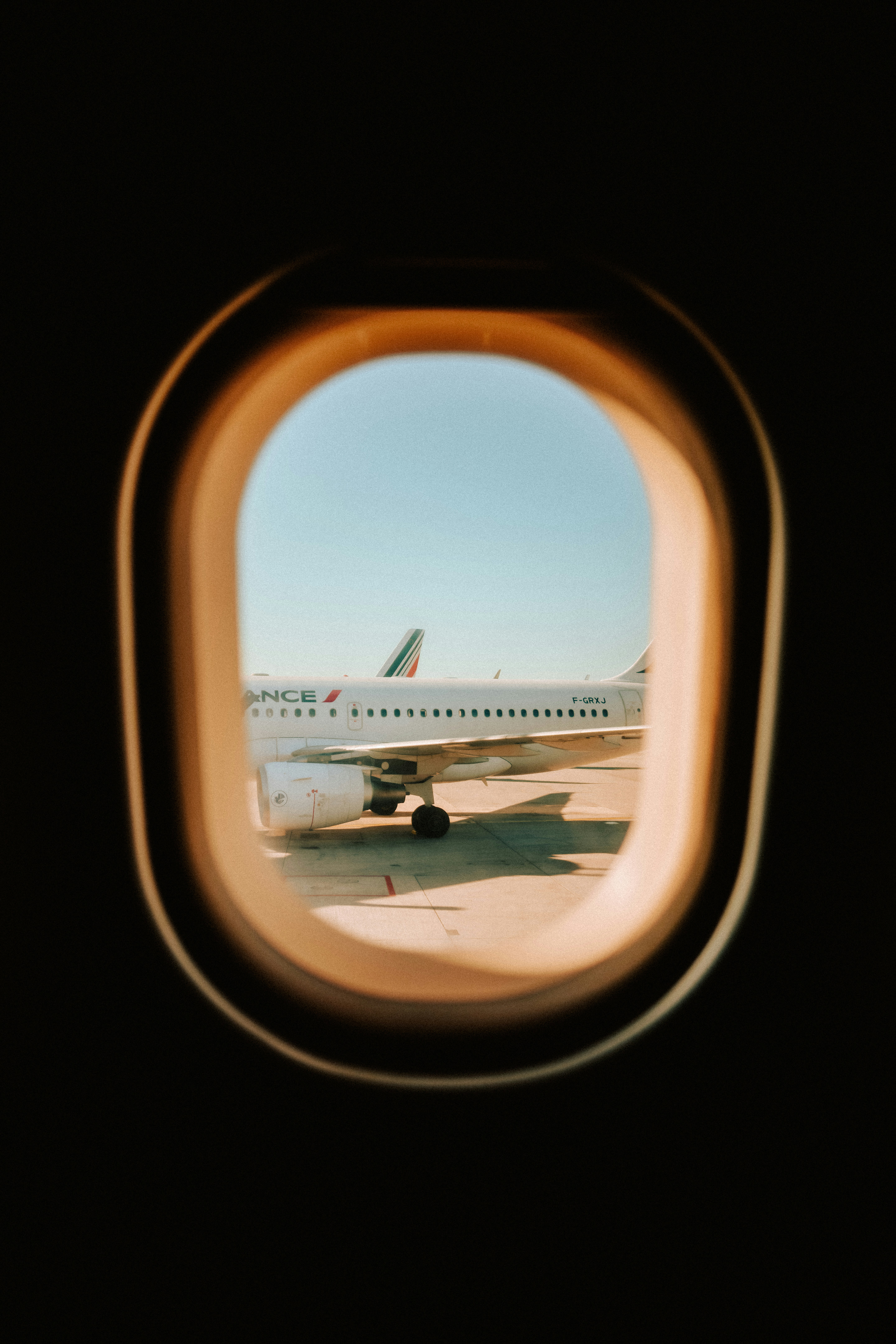 Amber Window View: Air France Jet on the Quiet Tarmac