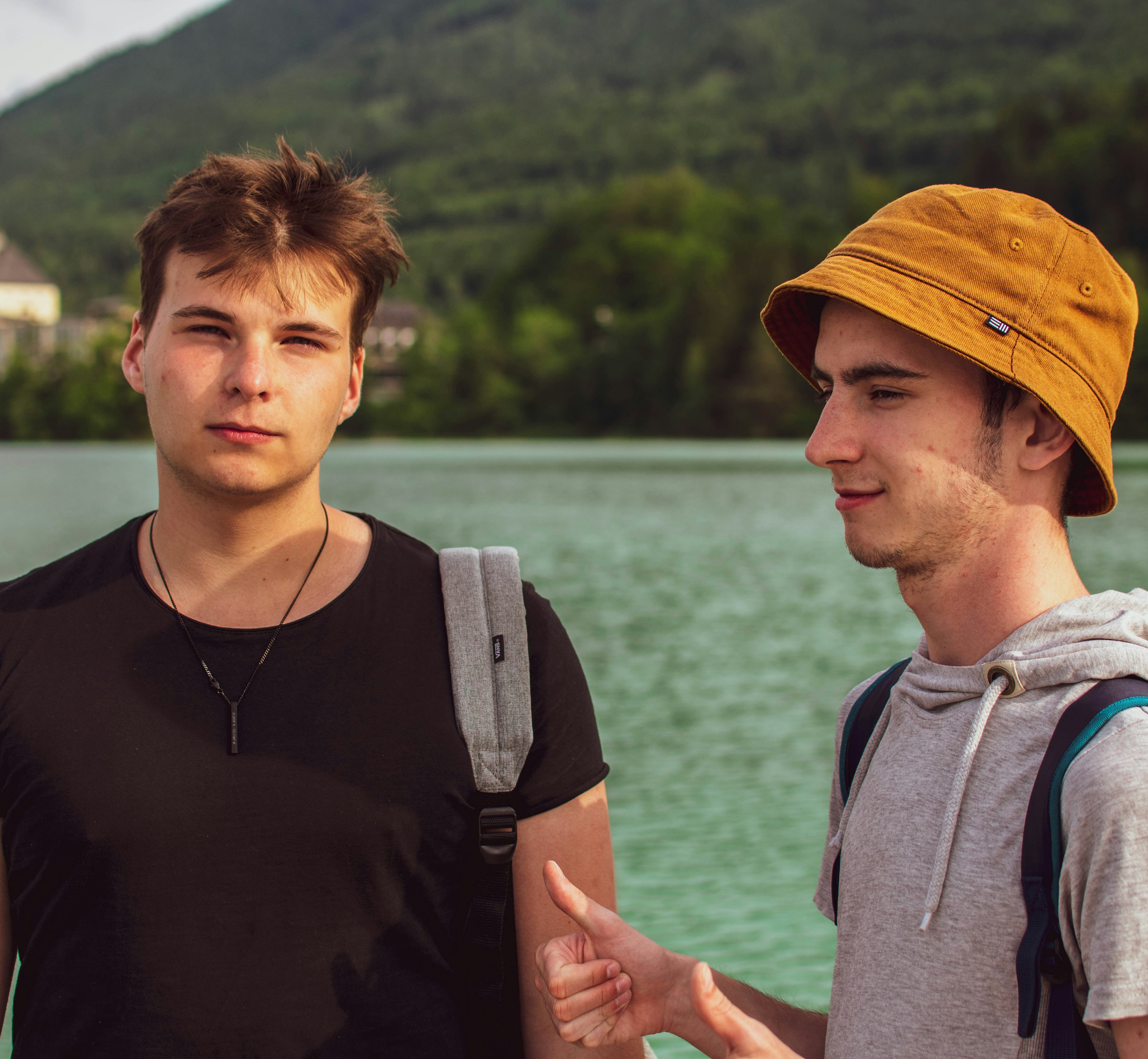 Two Friends by a Turquoise Lake: A Quiet Moment