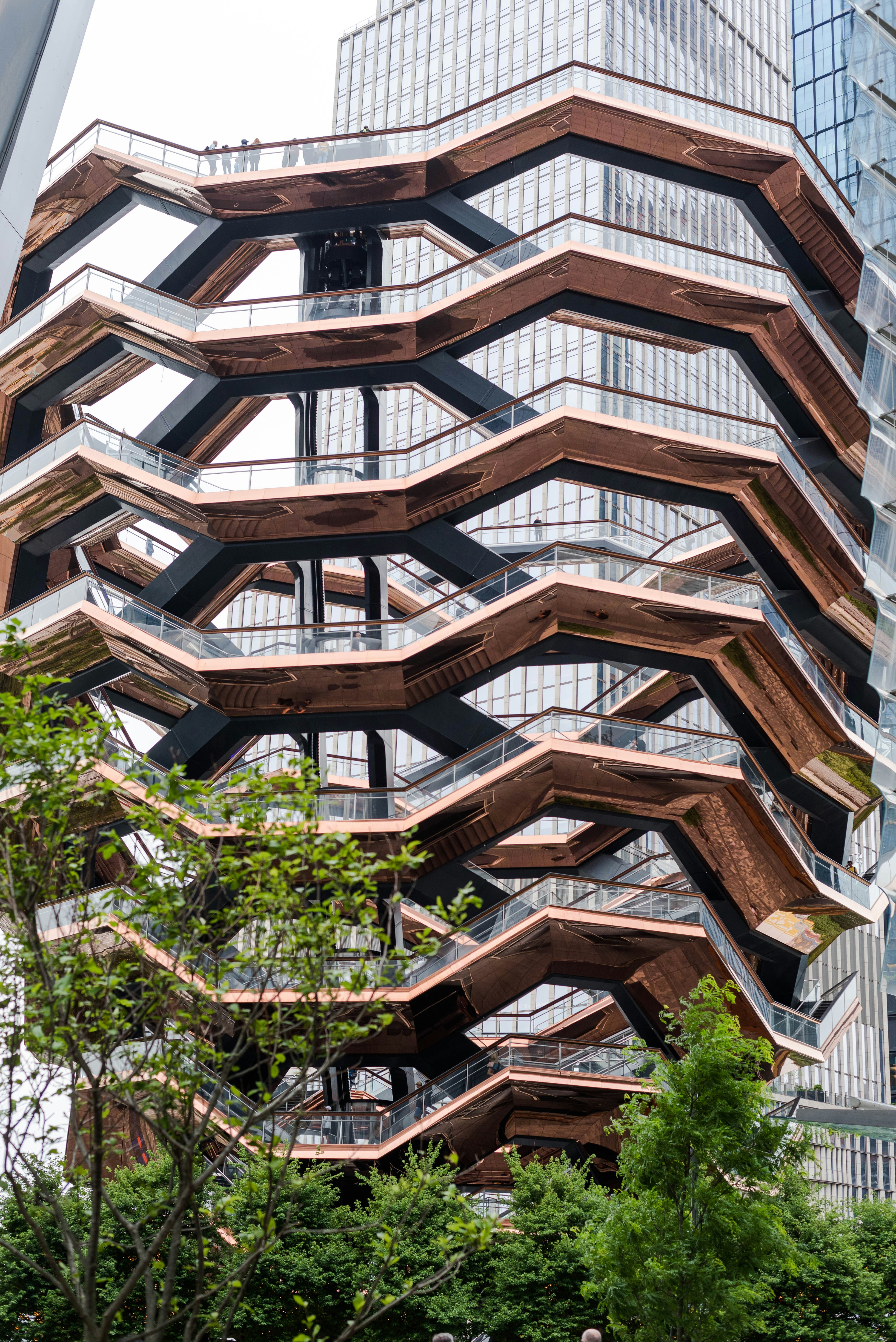 Copper Ribbons Ascend: The Vessel’s Terraced Facade Framing a City Garden