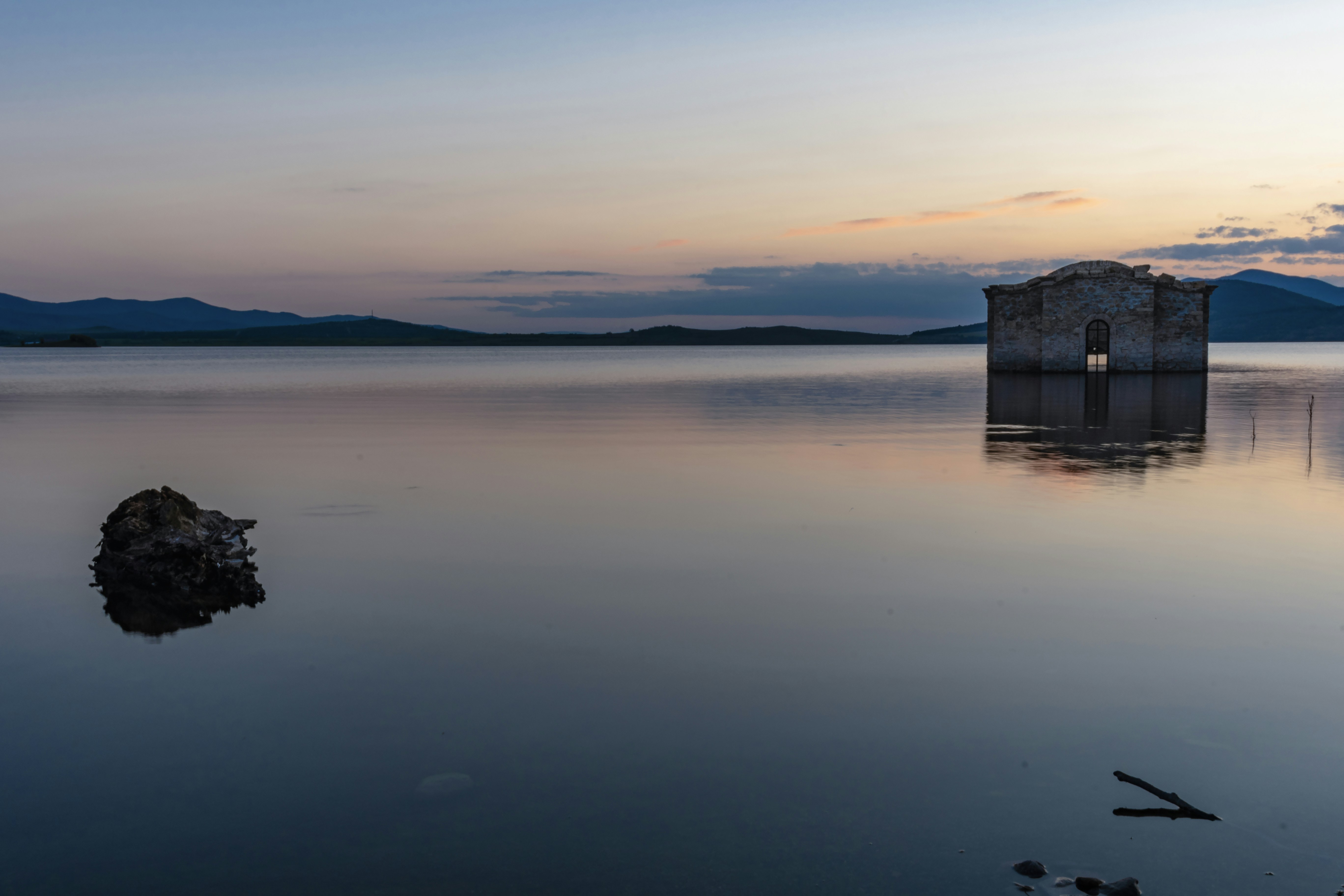 Bluehour Gate on a Glassy Lake: A Submerged Arch Quietly Rises